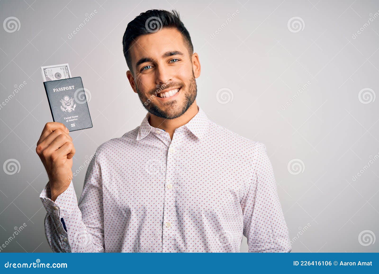 Young Handsome Tourist Man Holding United States Passport Id With Dollars With A Happy Face