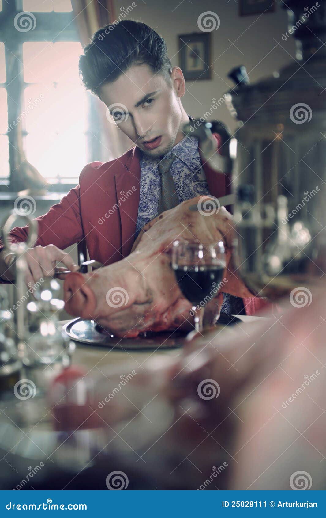 Young hansome men eat pig stock image. Image of adult - 25028111