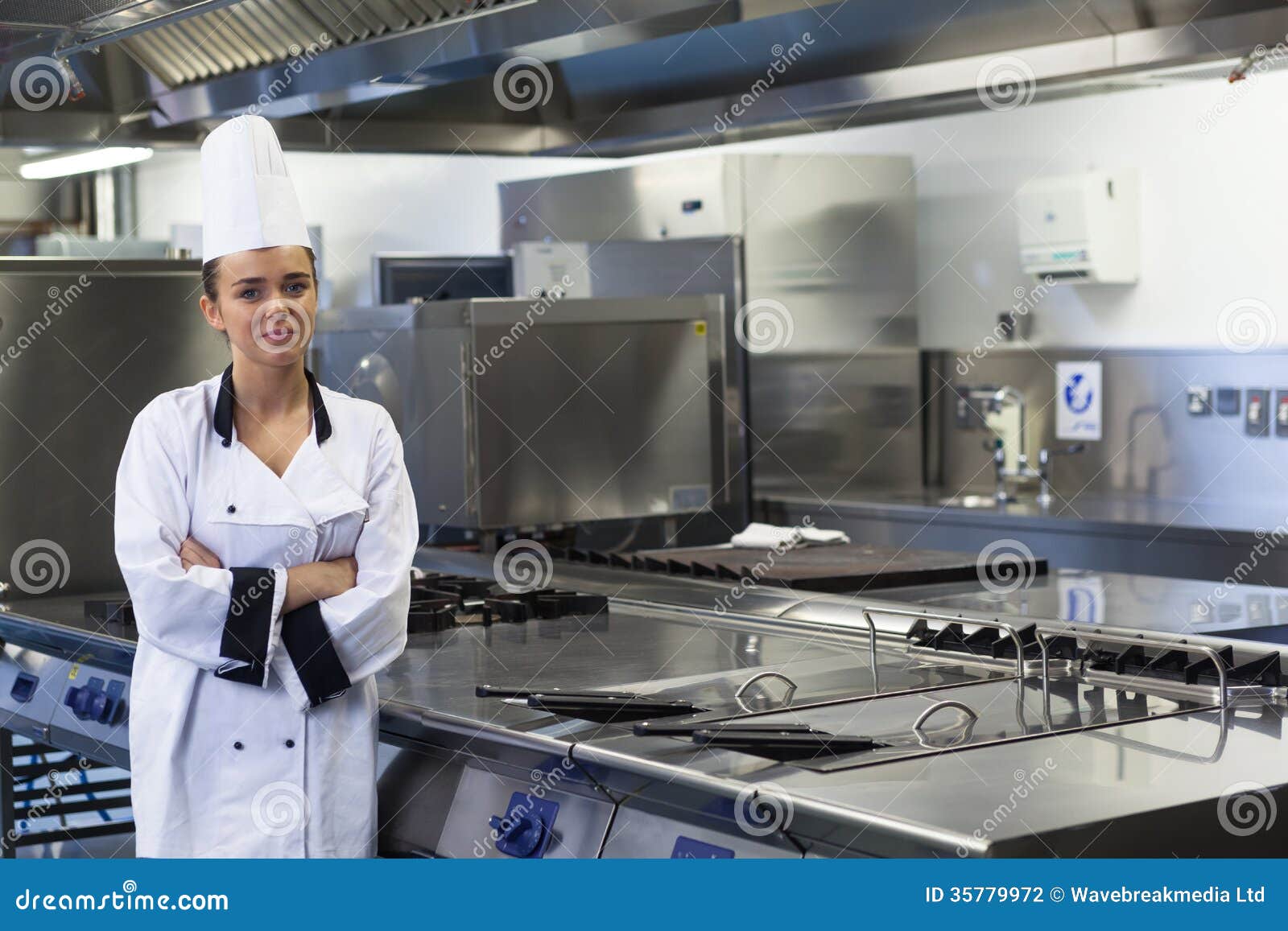 Young Happy Chef Standing Next To Work Surface Arms Crossed Stock Photo ...