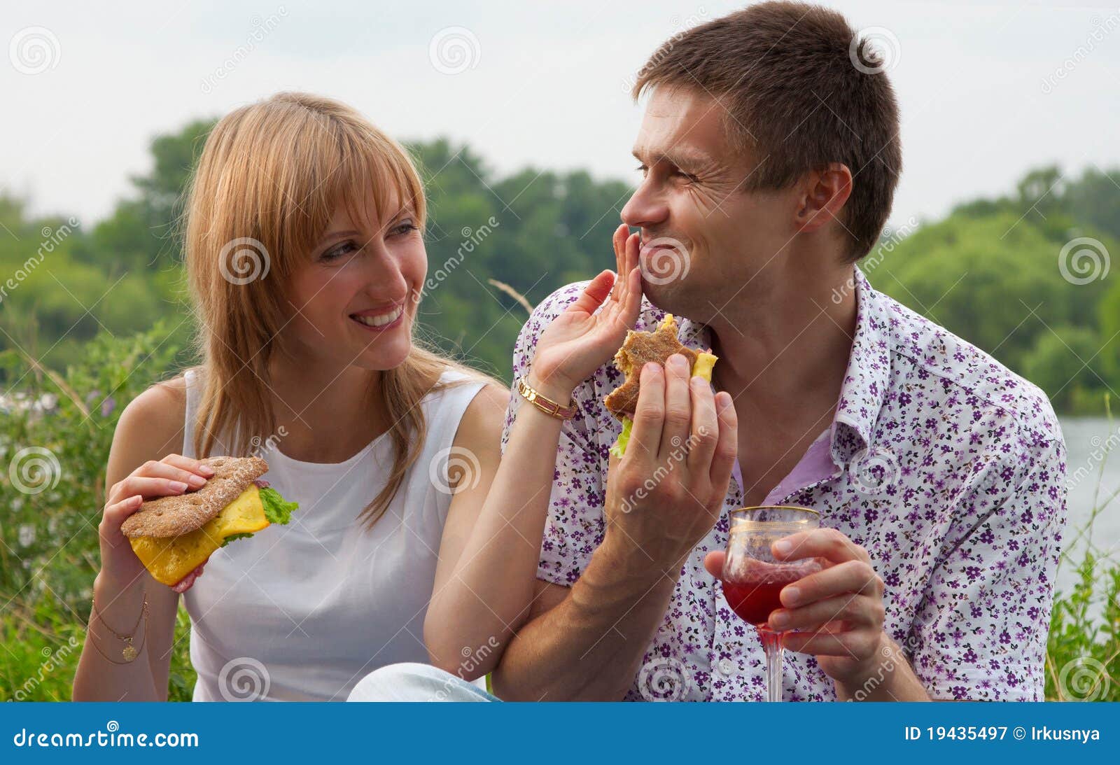 Young Happy Couple Eating Together Outdoors Stock Image - Image of ...