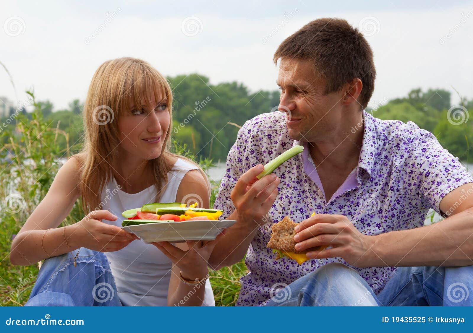 Young Happy Couple Eating Together Outdoors Stock Image - Image of ...