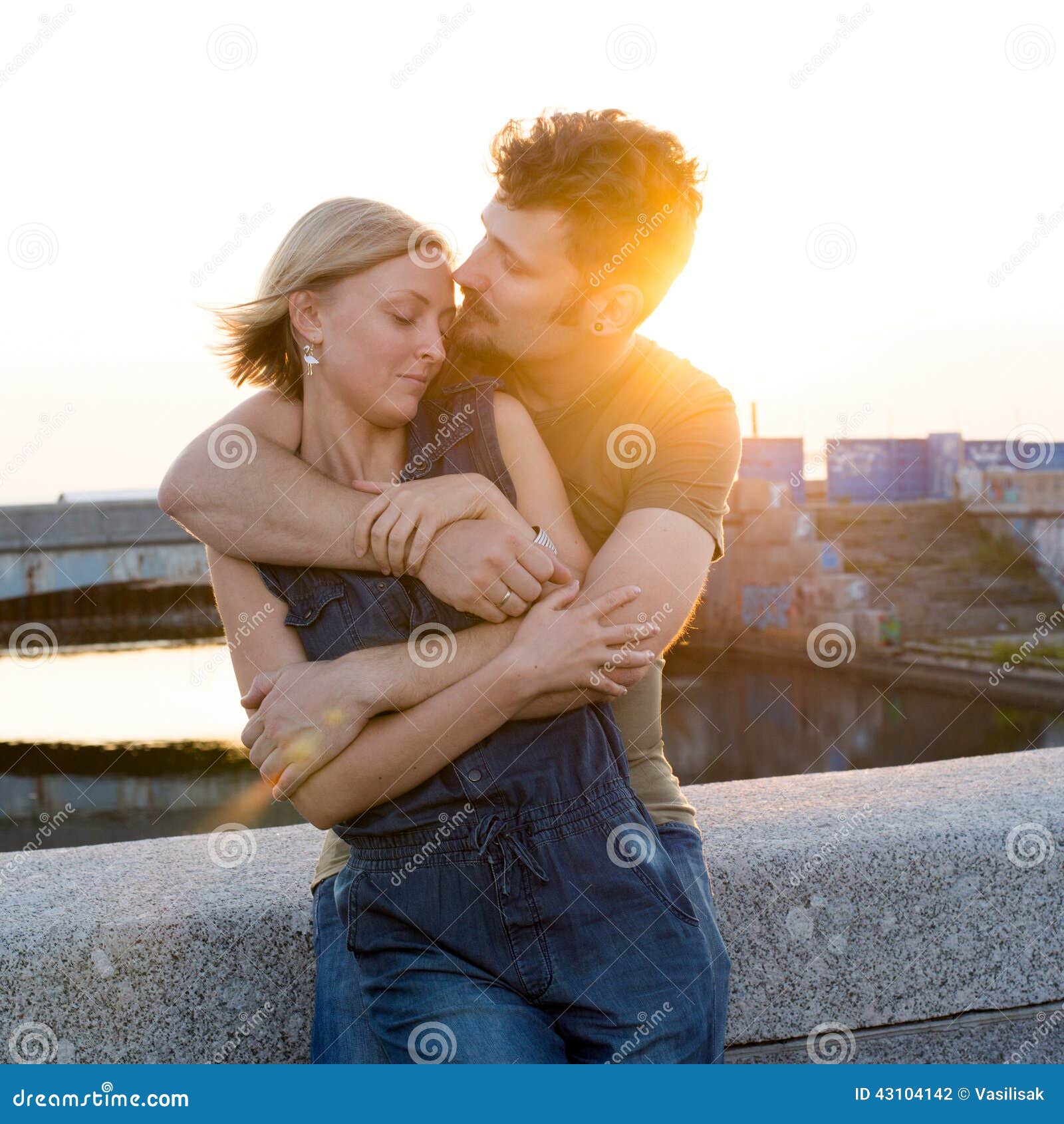 Young Happy Couple Embracing in Sunset Light Stock Photo - Image of ...