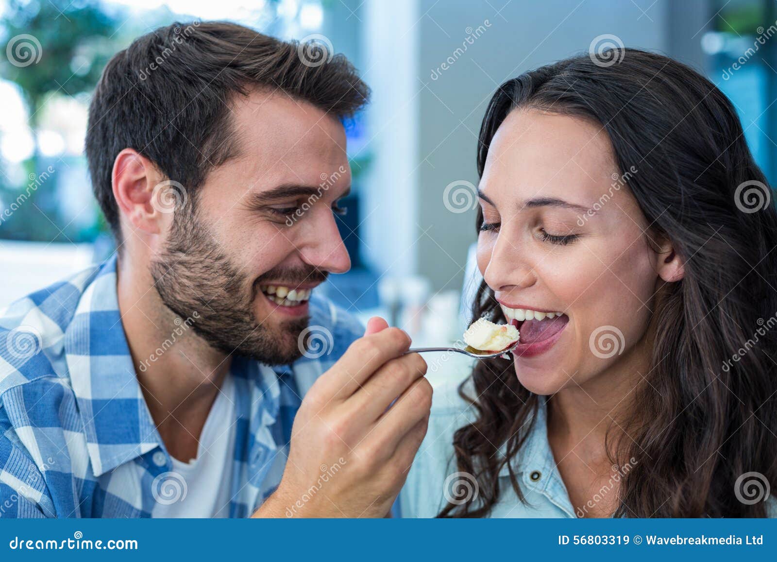 Young Happy Couple Feeding Each Other with Cake Stock Image - Image of ...