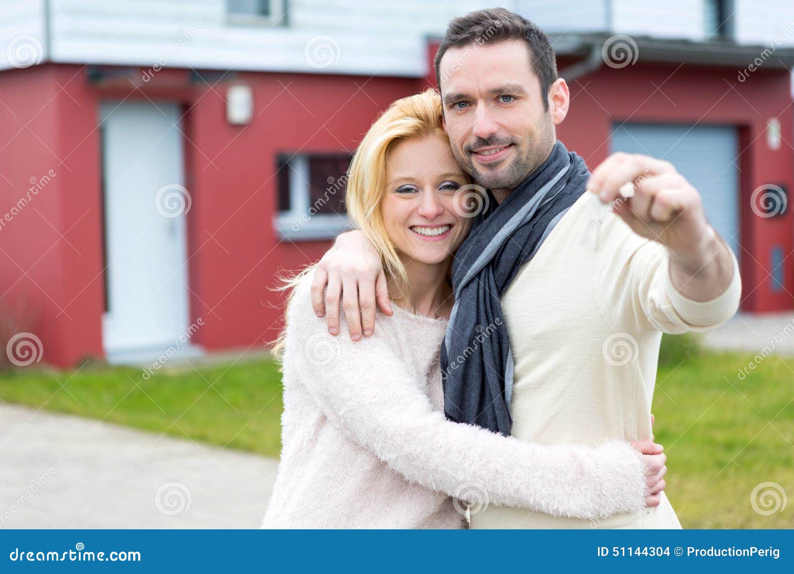 Young Happy Couple in Front of Their New House Stock Photo - Image of ...