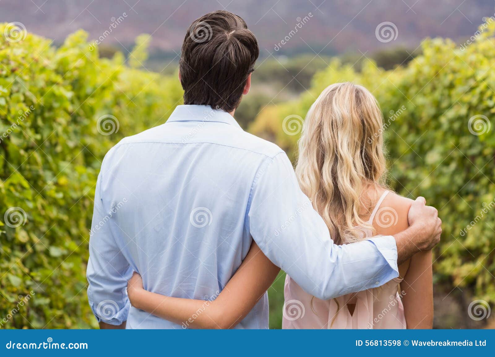 Young Happy Couple Having an Arm Around Each Other Stock Photo - Image ...