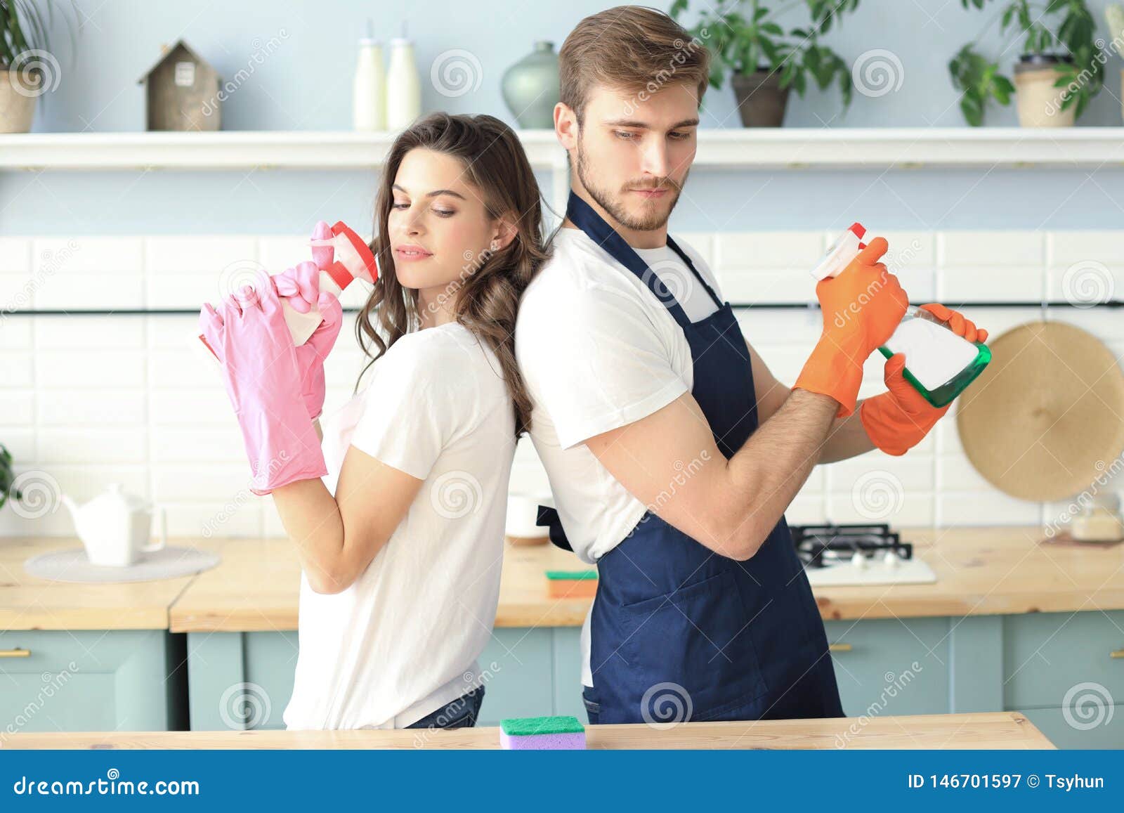 Young Happy Couple is Having Fun while Doing Cleaning at Home Stock ...