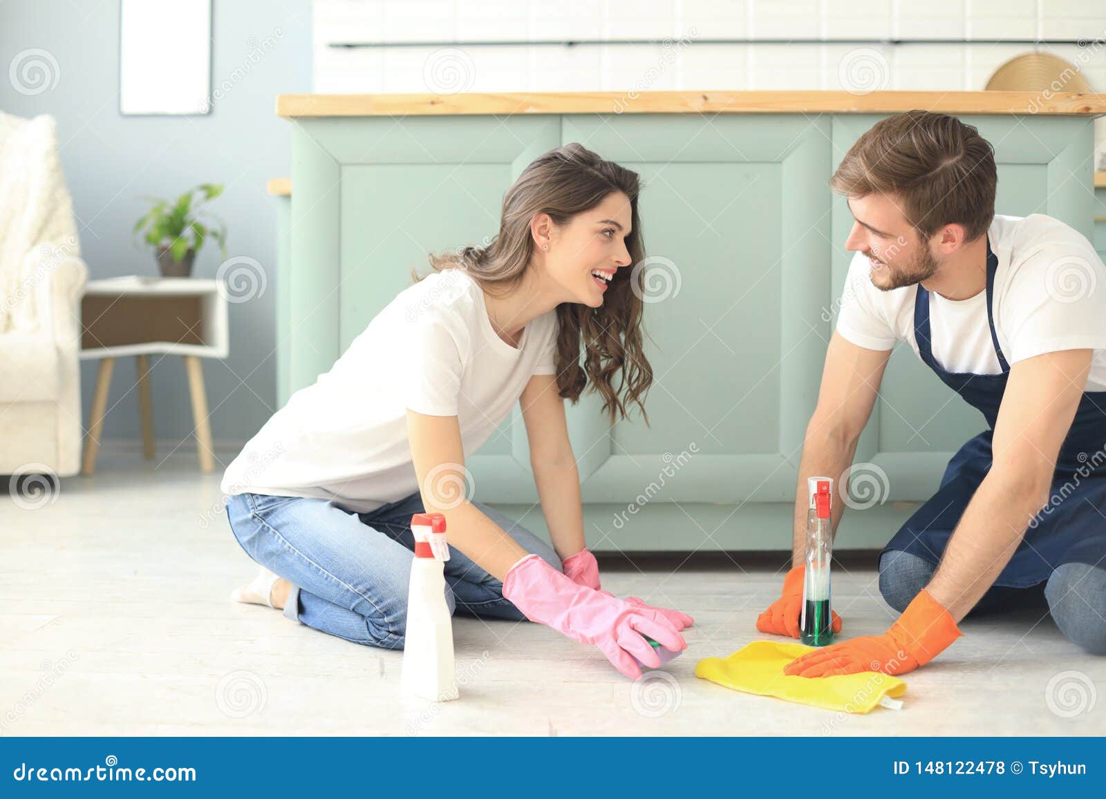 Young Happy Couple is Having Fun while Doing Cleaning at Home Stock ...