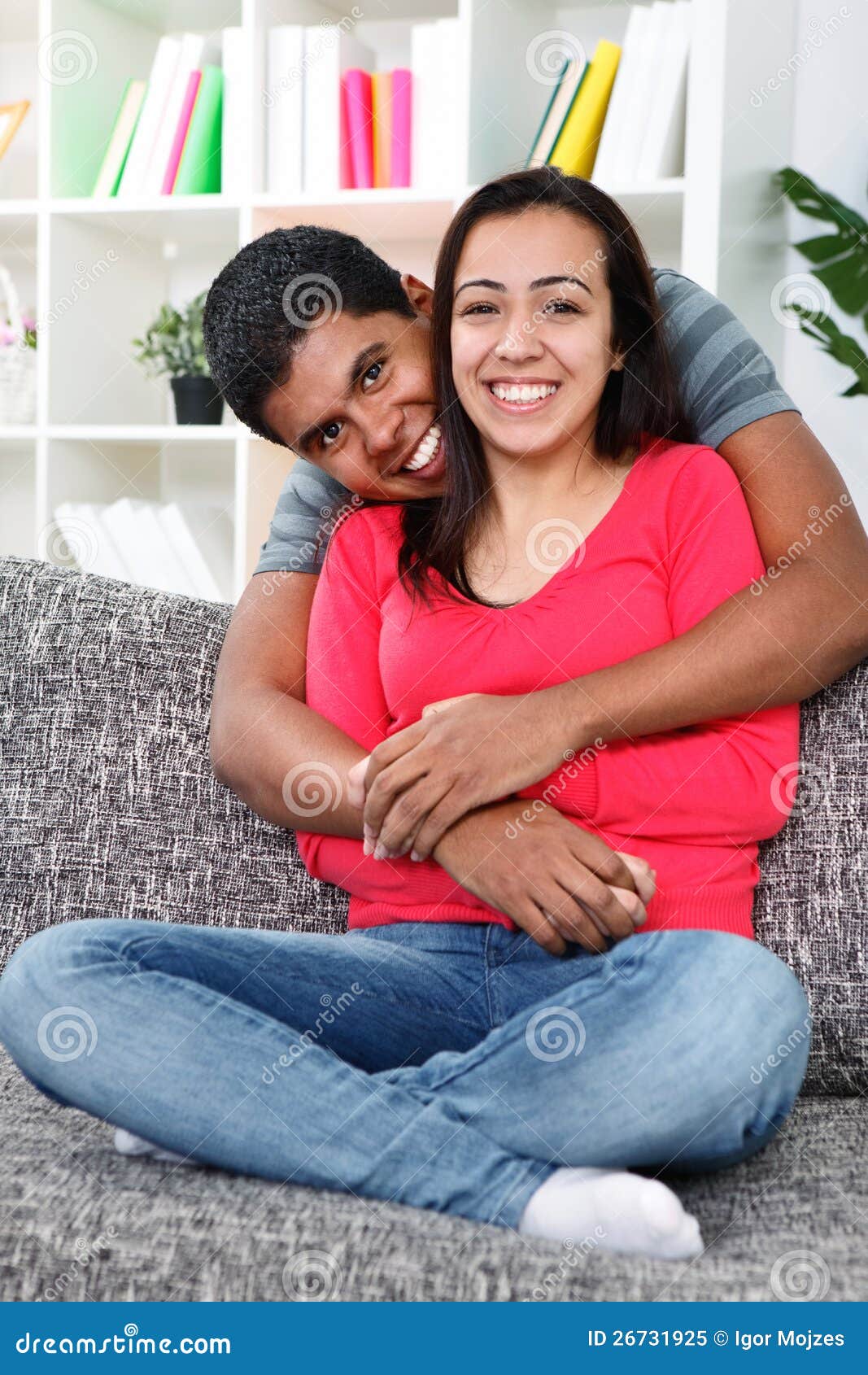Young happy couple at home stock image. Image of comfortable - 26731925