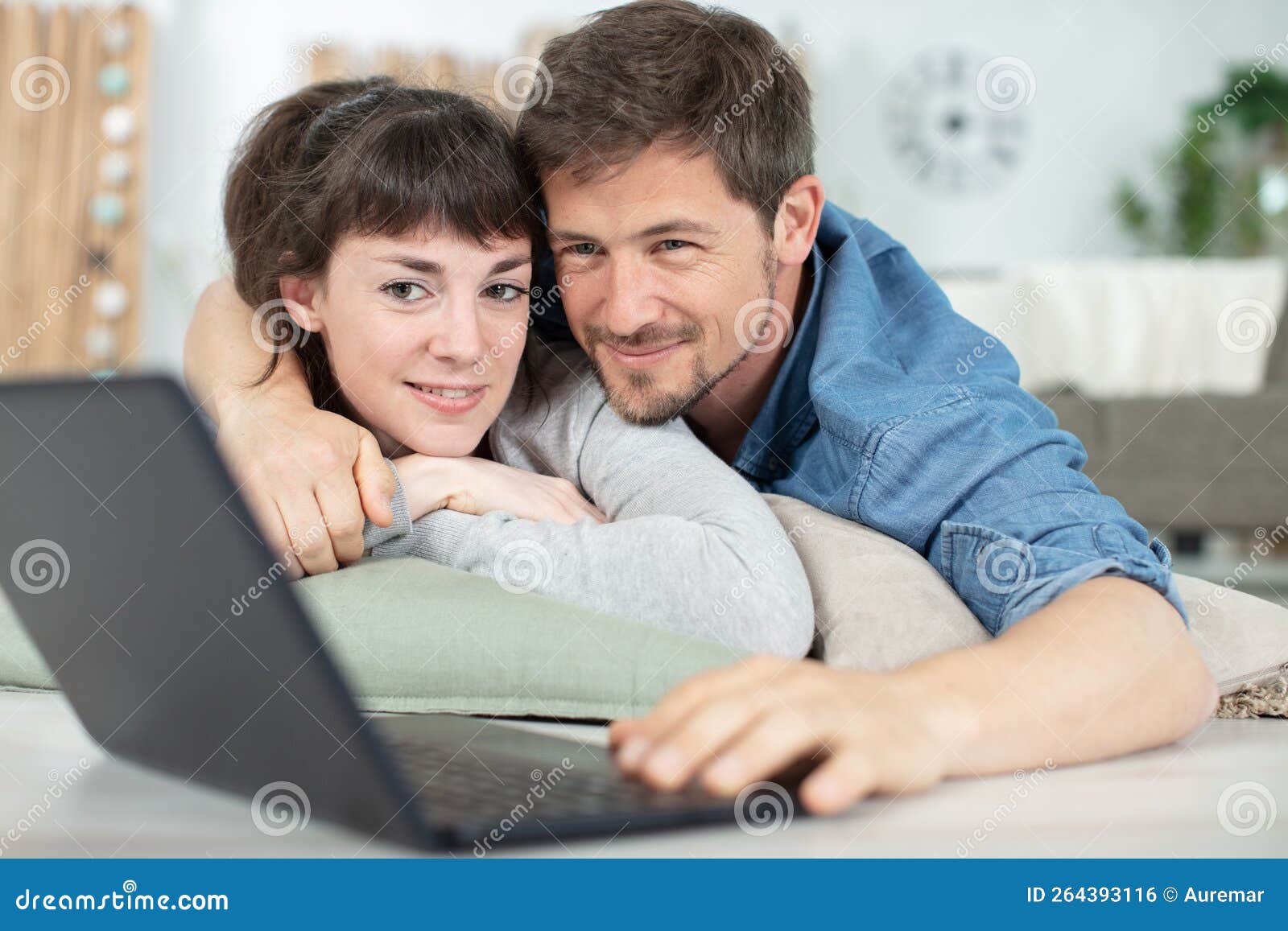 Young Happy Couple Hugging and Using Pc Stock Photo - Image of movie ...