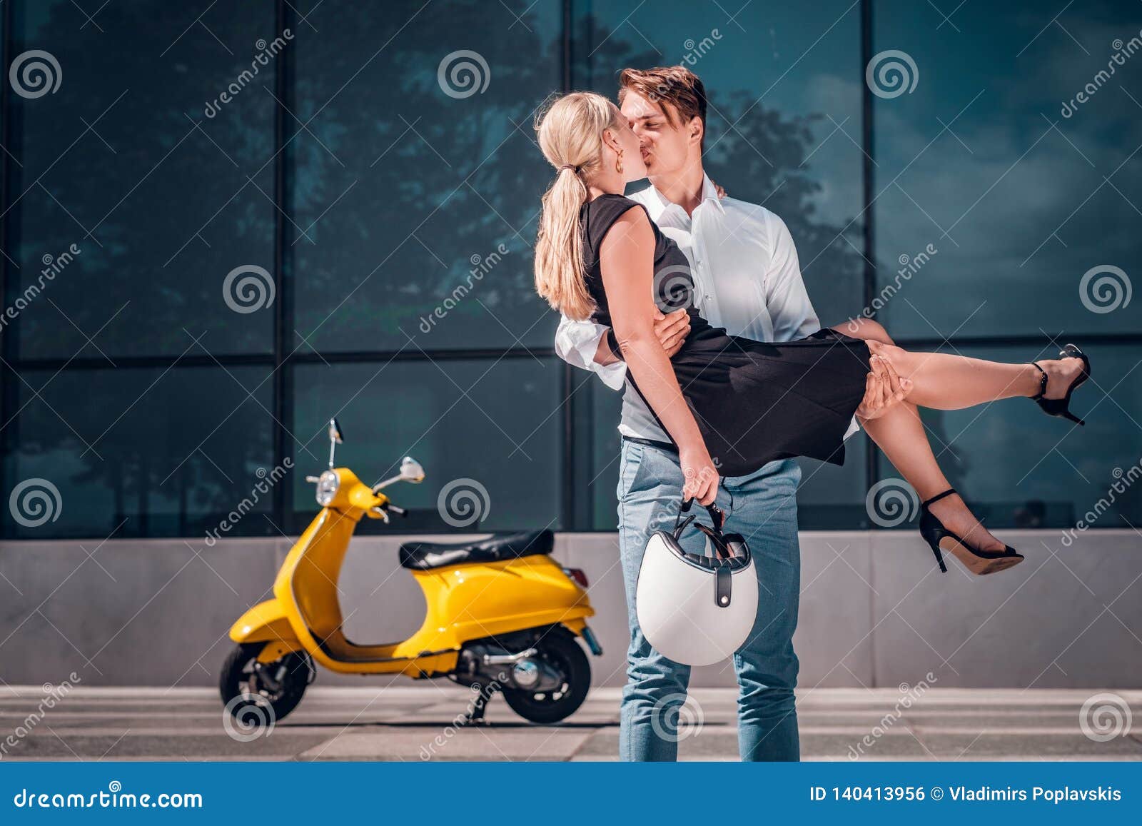 Romantic Couple In Love A Guy Kisses His Girlfriend Holding Her On His