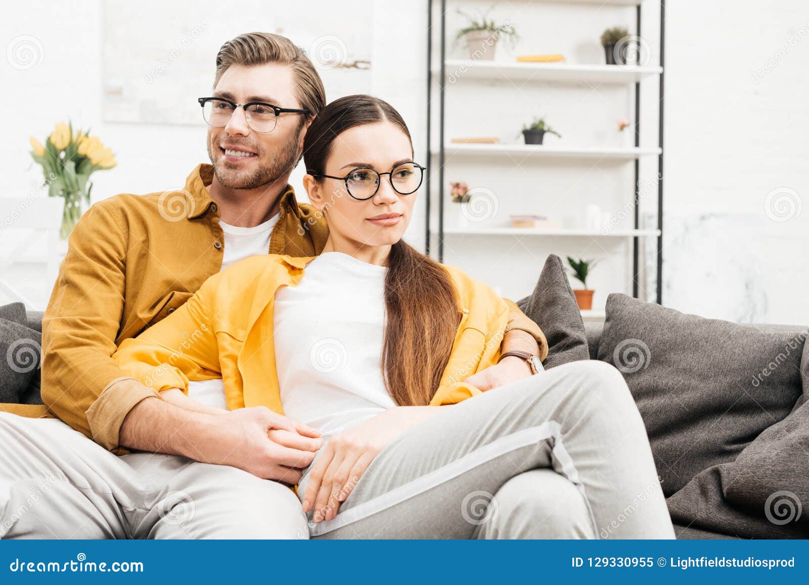 Young Happy Couple Relaxing on Comfy Couch Stock Image - Image of ...
