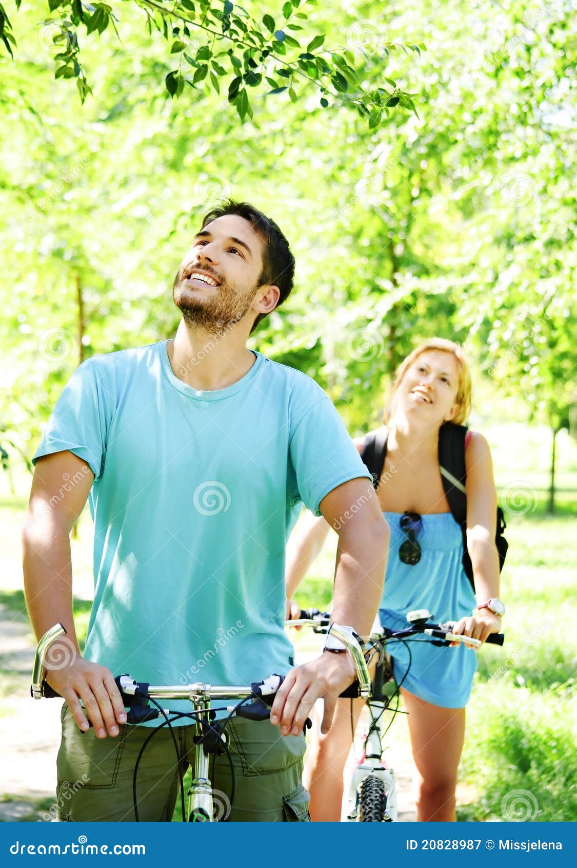 Young Happy Couple Riding a Bicycle Stock Image - Image of people ...
