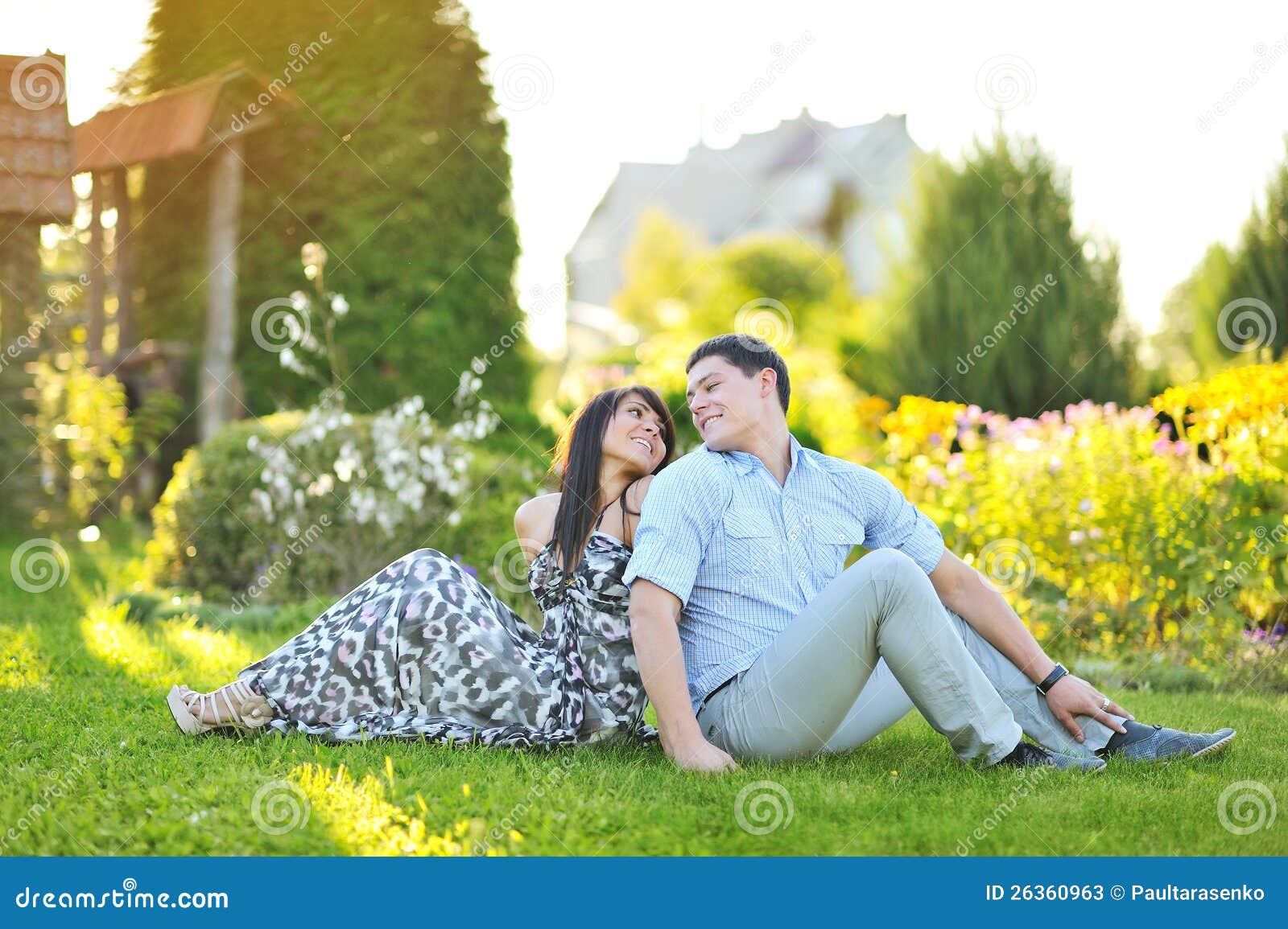 Young Happy Couple Sitting Back To Back Stock Image - Image of brunette ...