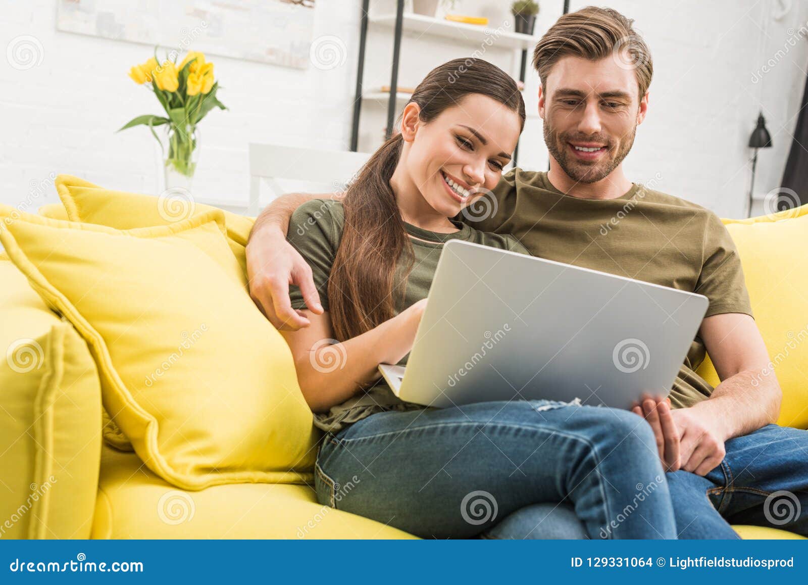 Young Happy Couple Using Laptop Together Stock Photo - Image of smiling ...