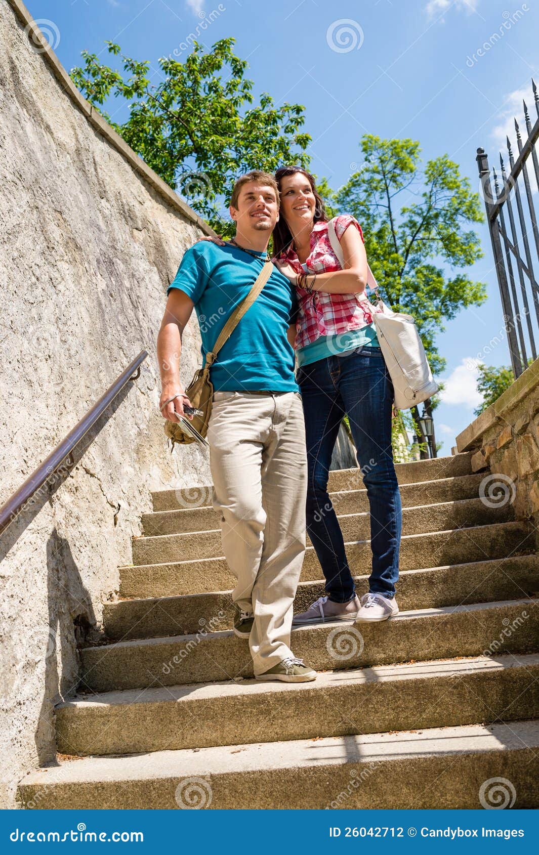 Young Happy Couple Walking Down Stairs Smiling Stock Photo - Image of ...