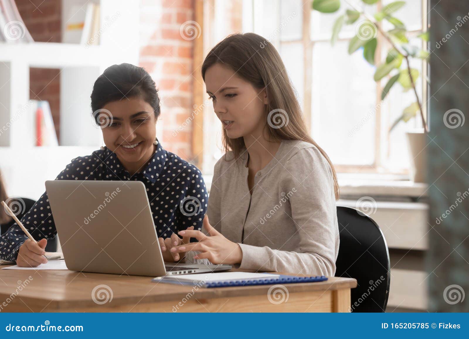 Young Happy Diverse Interns Working Together on Project. Stock Image ...