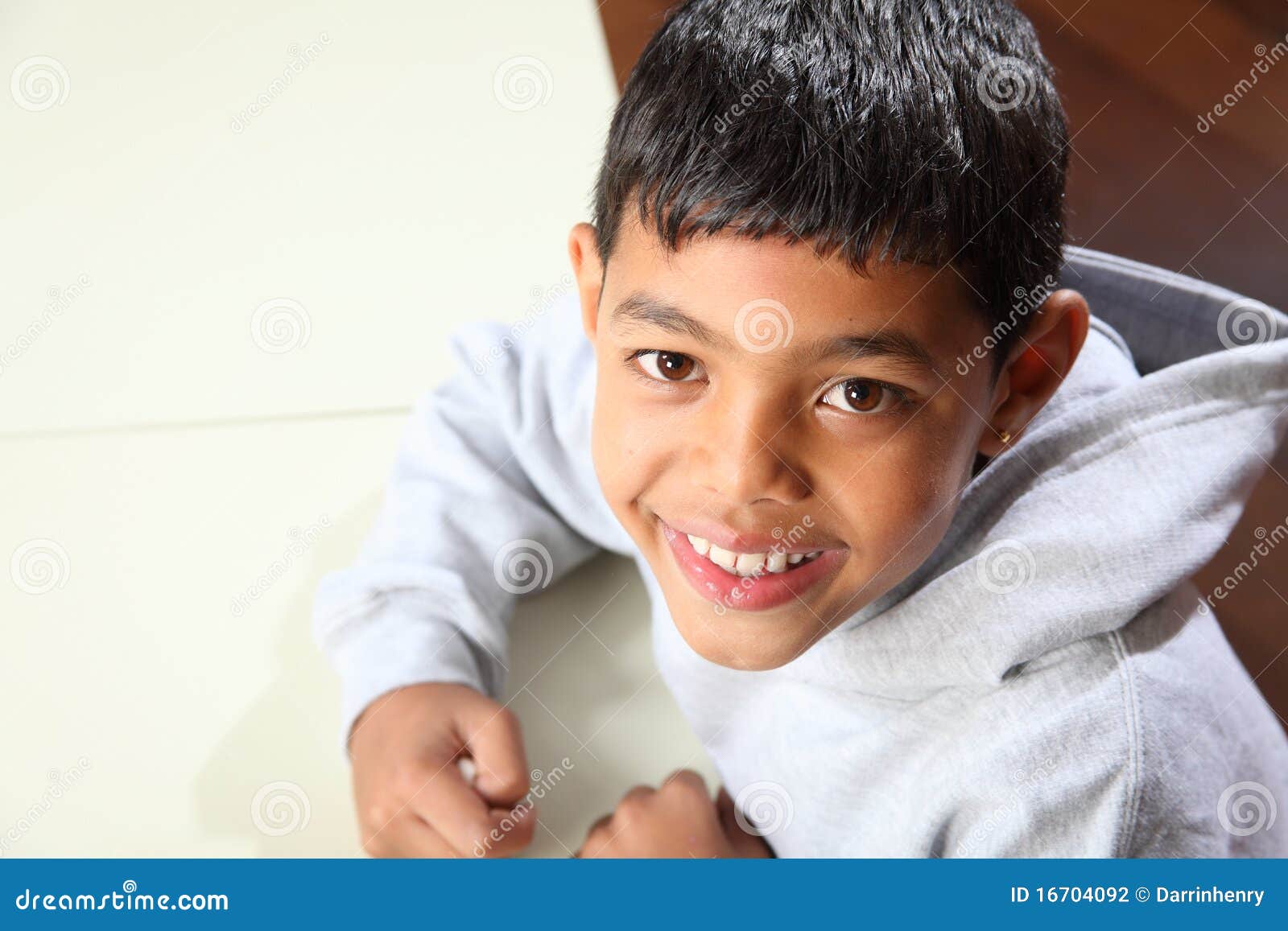 Young Happy Ethnic School Boy 9 Sitting in Class Stock Photo - Image of ...