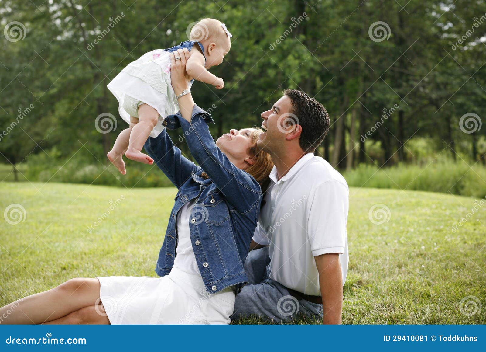 Young Happy Family stock image. Image of meadow, love - 29410081
