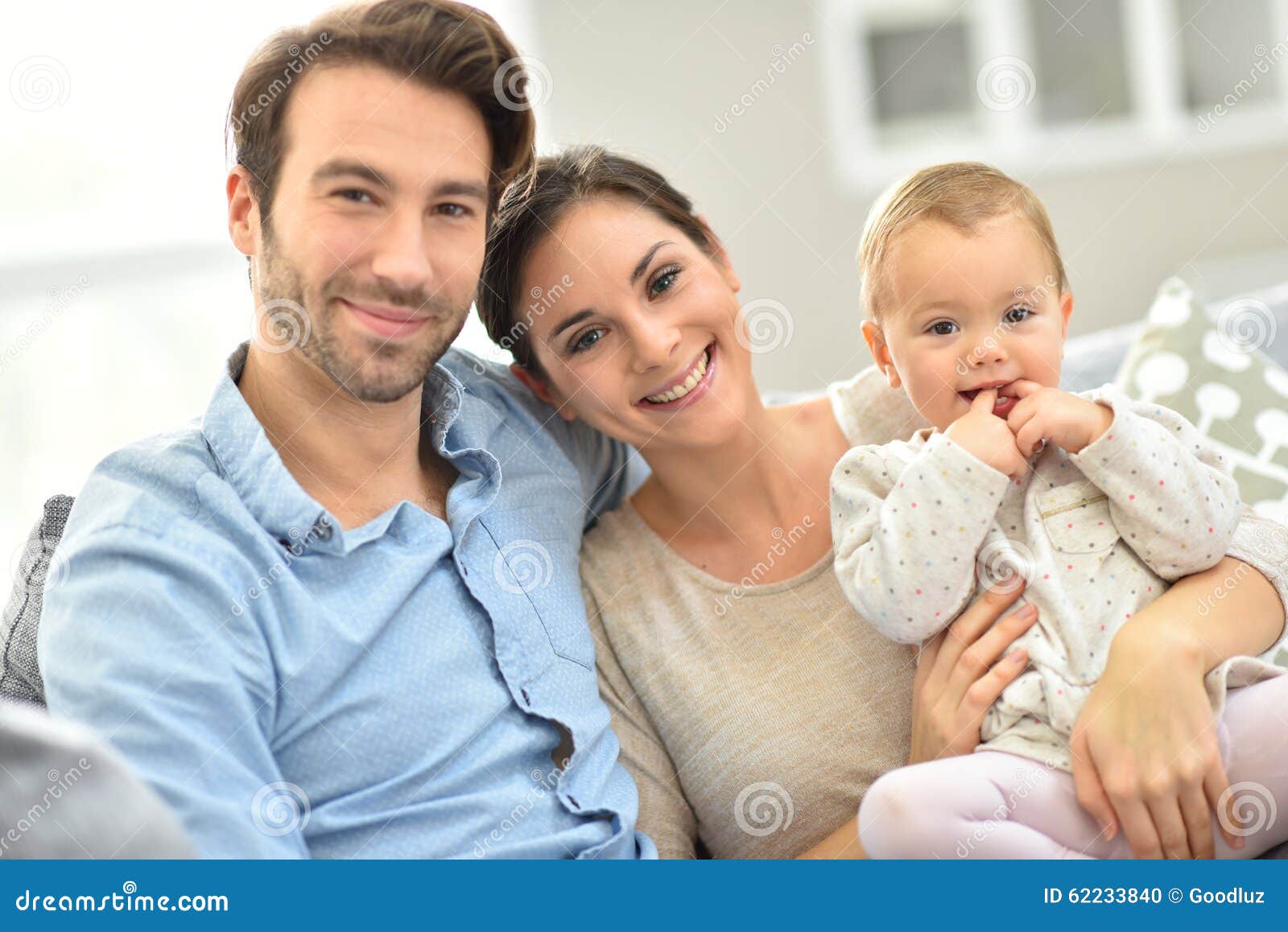 Young Happy Family of Three on Sofa Stock Photo - Image of little ...