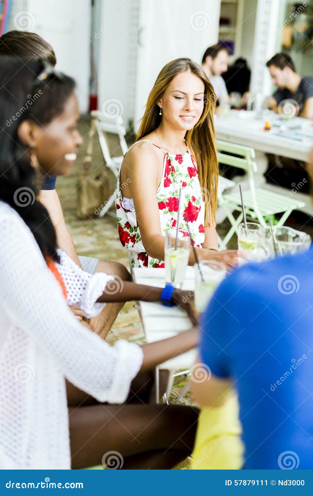 Young and Happy Friends Sitting Talking at a Table Stock Image - Image ...