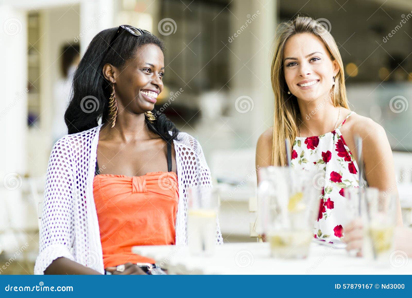 Young and Happy Friends Sitting Talking at a Table Stock Image - Image ...