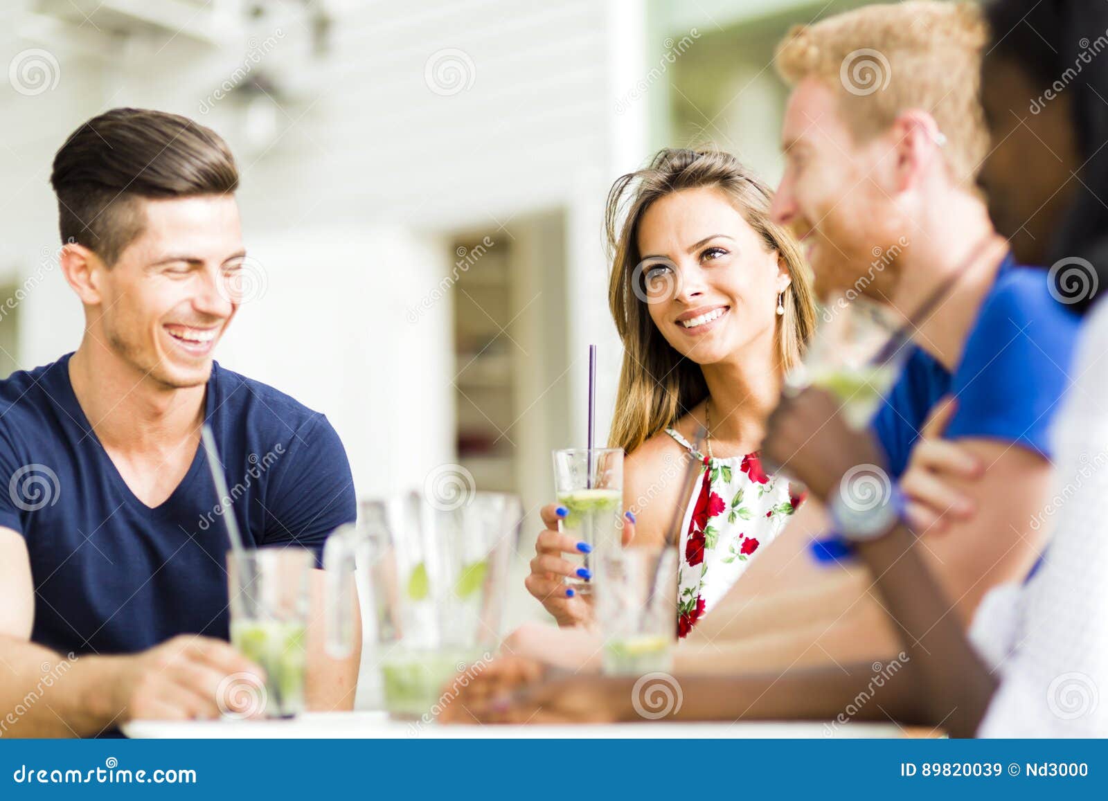Young and Happy Friends Sitting Talking at a Table Stock Image - Image ...