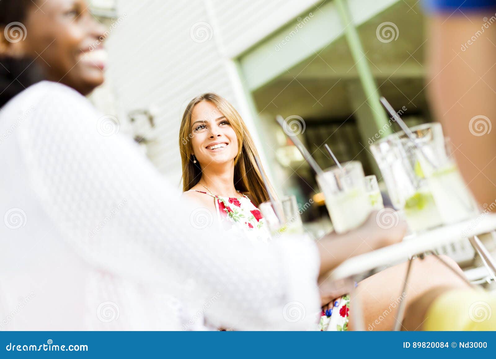 Young and Happy Friends Sitting Talking at a Table Stock Photo - Image ...