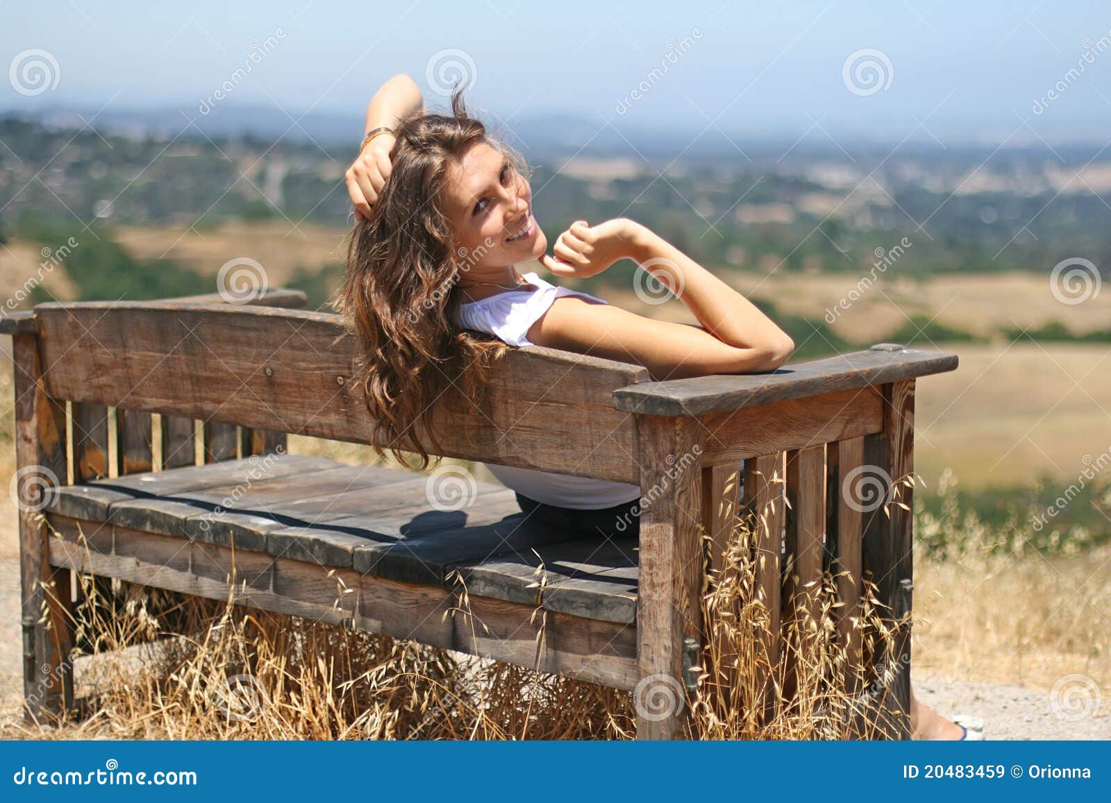 Young Happy Girl on a Bench Stock Image - Image of human, adult: 20483459
