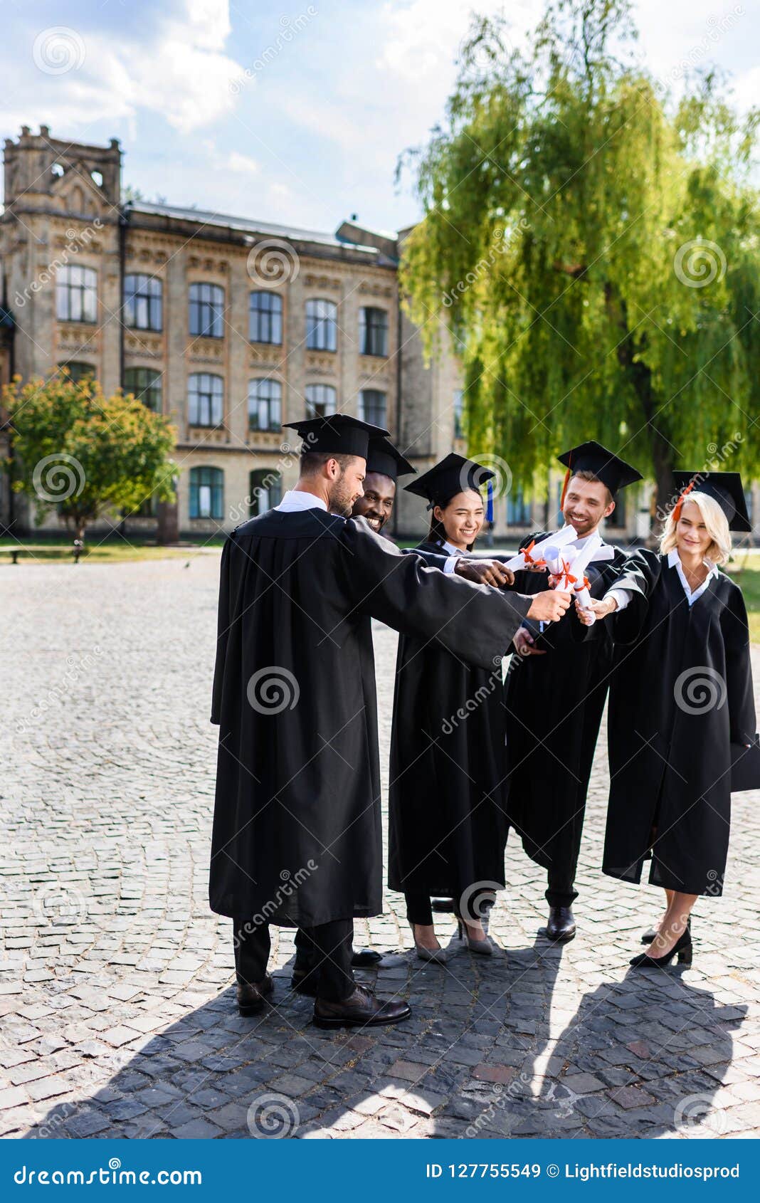 Young Happy Graduated Students Making Team Gesture Stock Image - Image ...