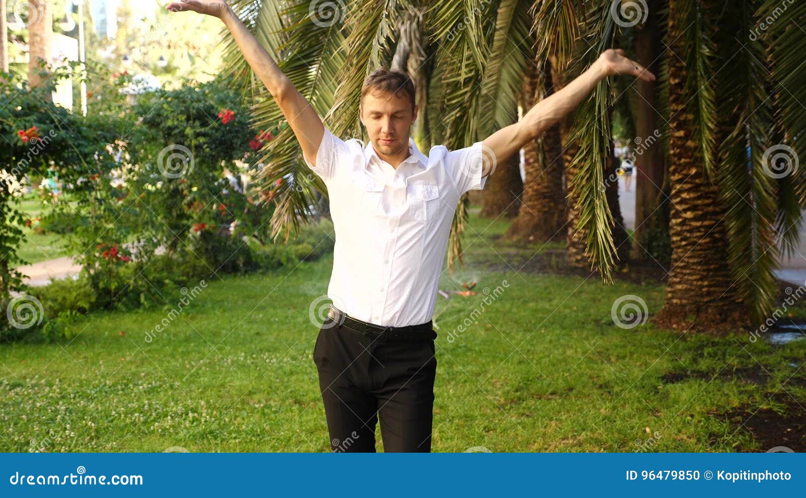 A Young Happy Guy Dancing Modern Ballet and Wacking in a Summer Park ...
