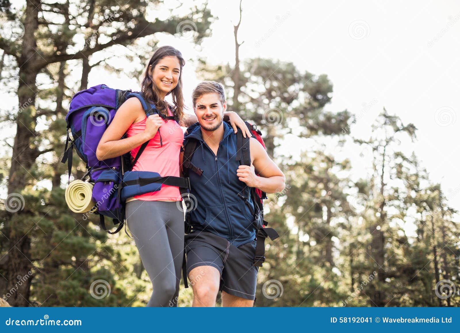 Young Happy Joggers Standing on Rock Looking at Camera Stock Image ...