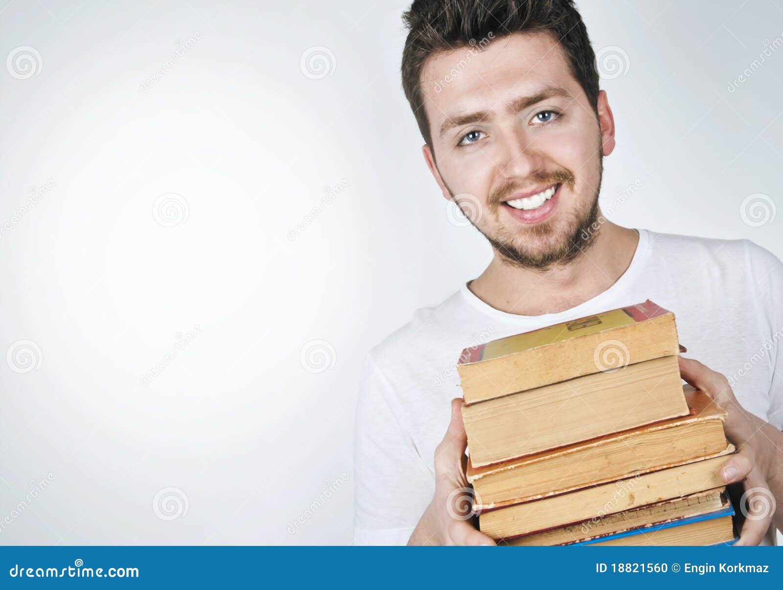 Young Happy Man Carrying Books Stock Photo - Image of casual, joyful ...