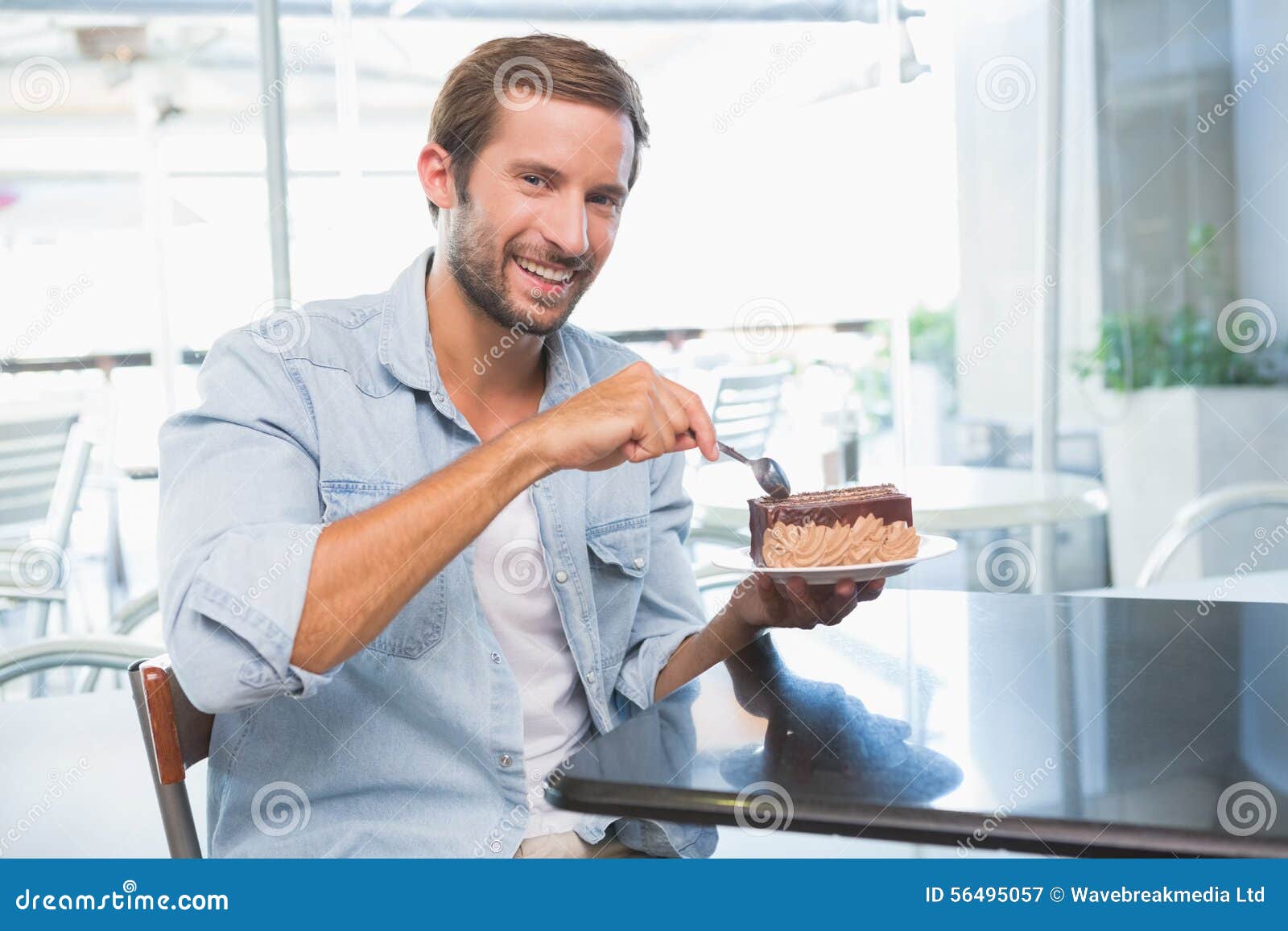 Young Happy Man Eating His Cake Stock Image - Image of city, shirt ...
