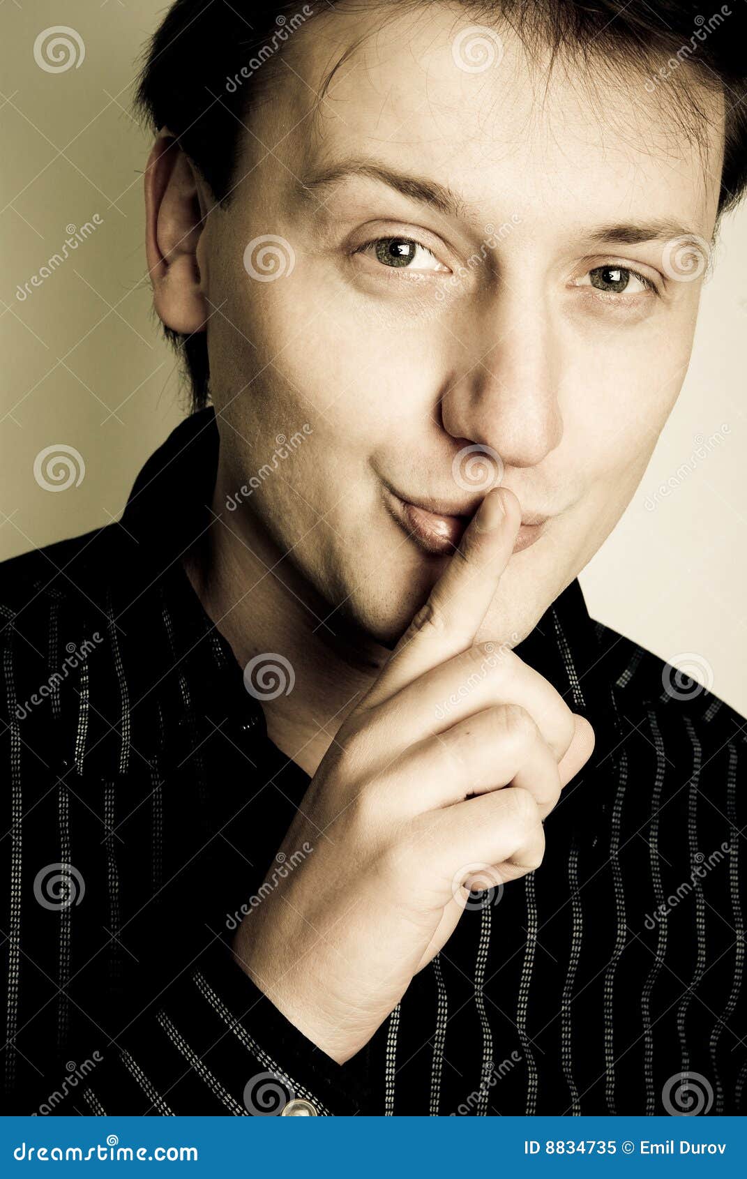 Young Happy Man with His Finger Over His Mouth Stock Image - Image of ...