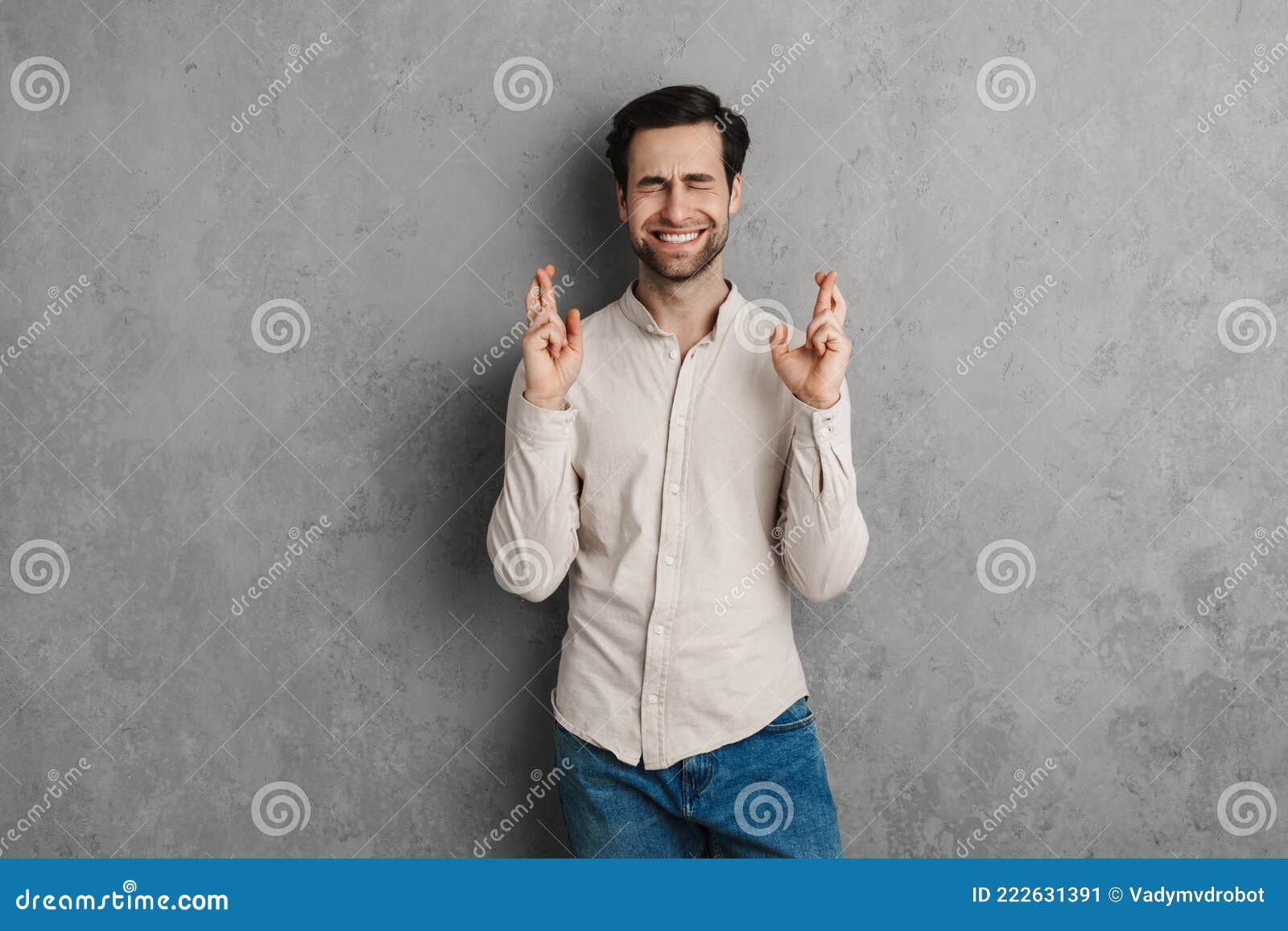Young Happy Man Making a Wish Isolated on Gray Stock Image - Image of ...
