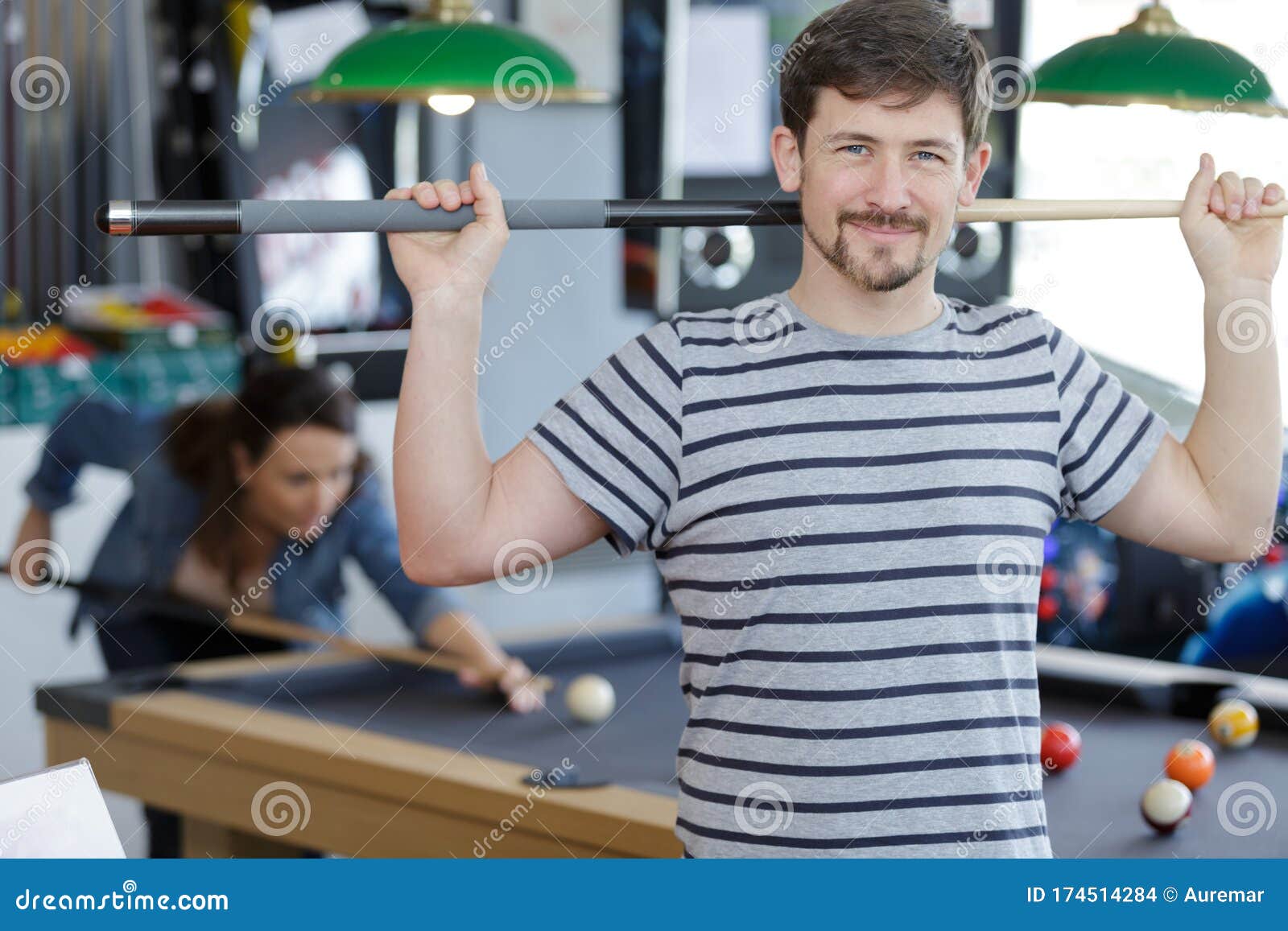 Young Happy Man Playing Billiard and Posing for Camera Stock Photo ...