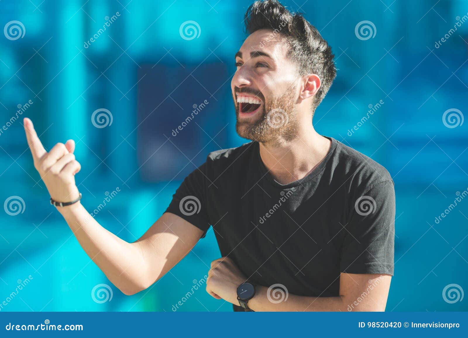 Young Happy Man Pointing Up Laughing Stock Photo - Image of modern ...