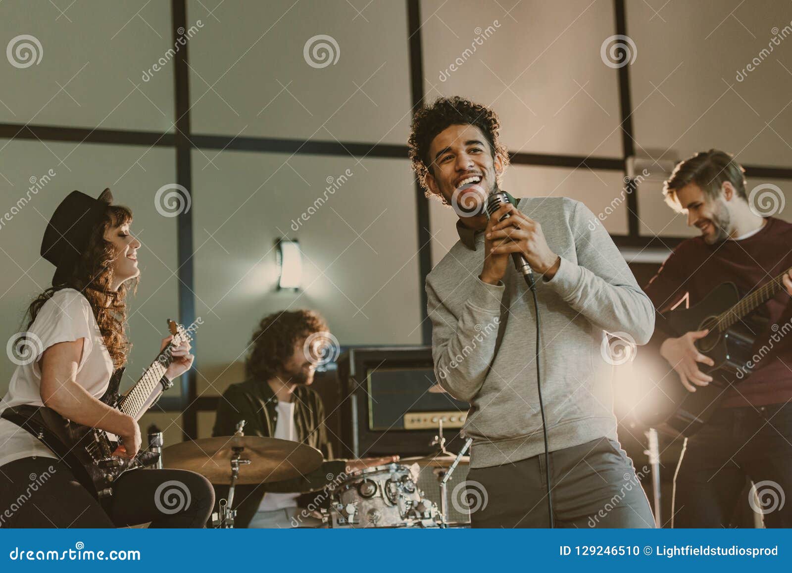 Young Happy Musicians Performing Stock Photo - Image of caucasianmen ...