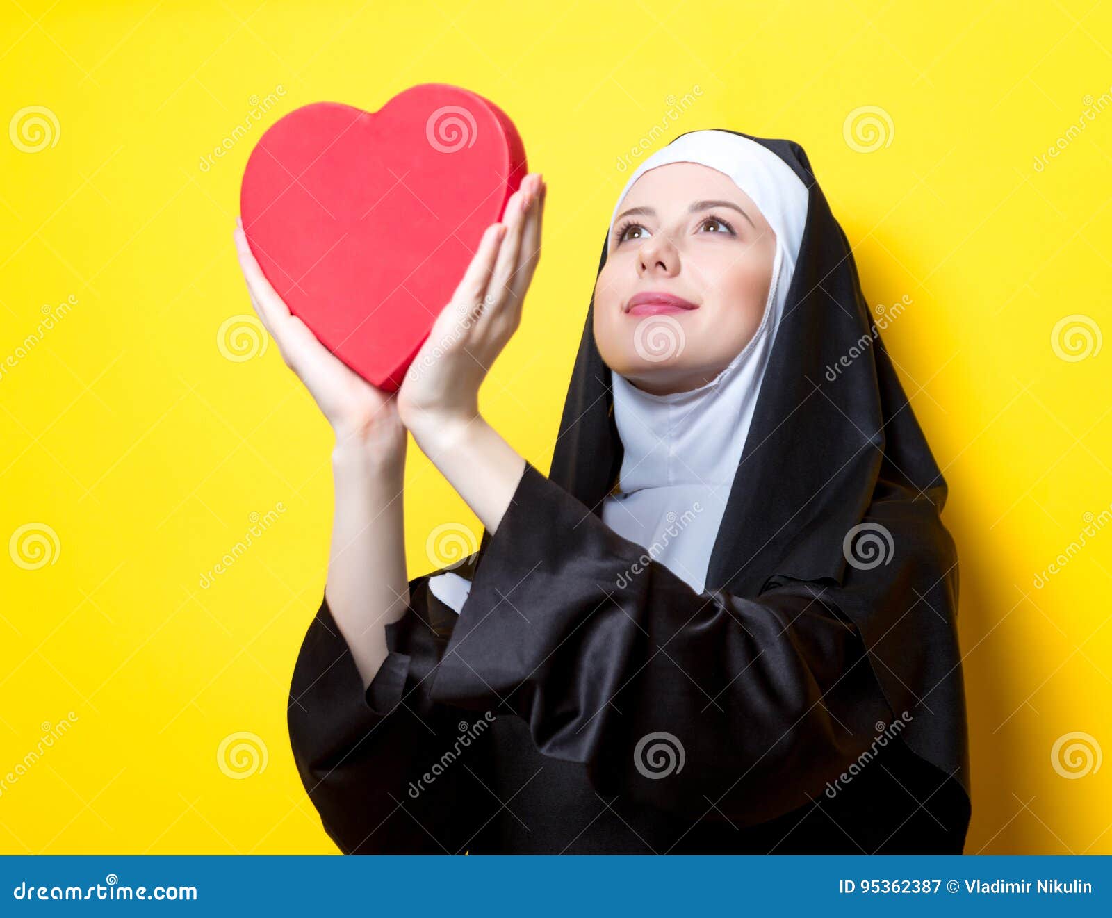 Young Happy Nun with Heart Shape Box Stock Image - Image of black ...