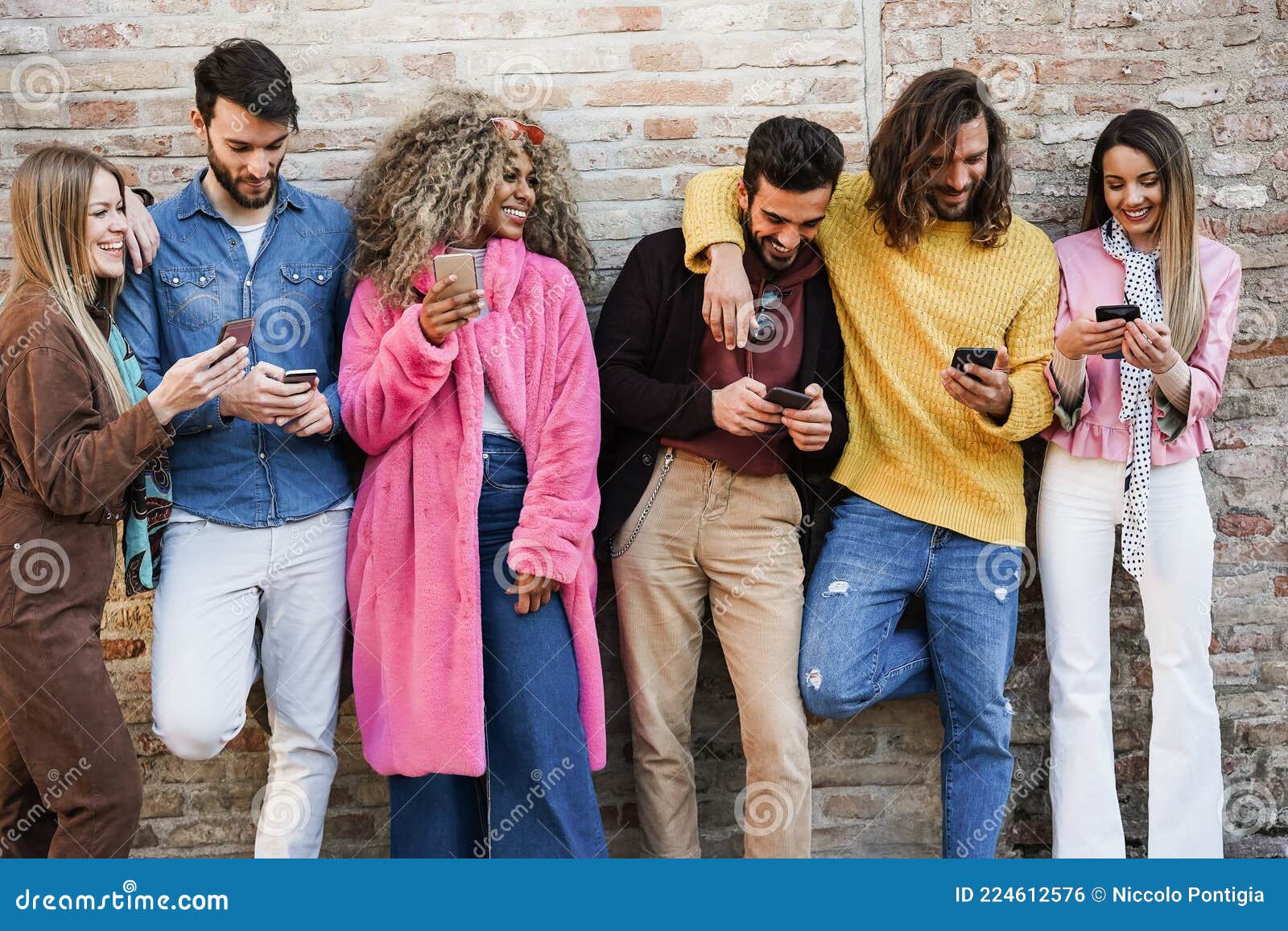 Young Happy People Having Fun Together with Mobile Phone App - Focus on ...