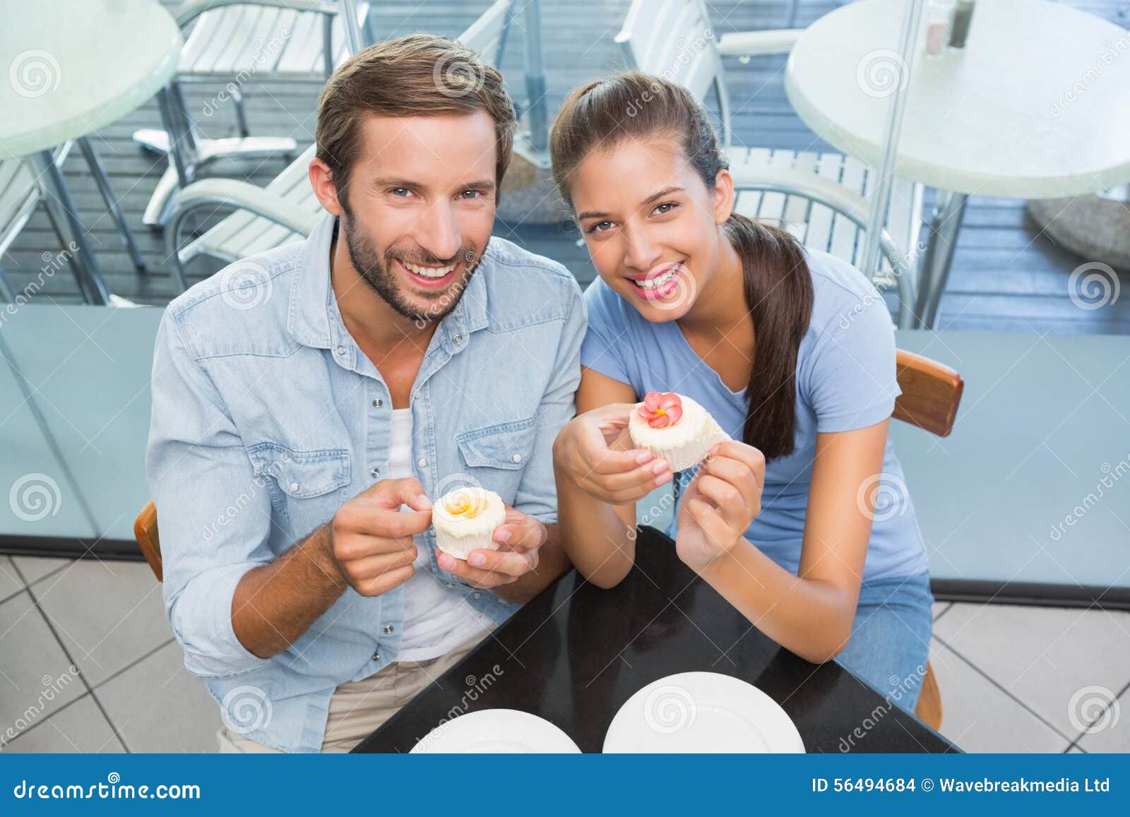 Young Happy Smiling Couple Eating Cake while Looking at the Camera ...