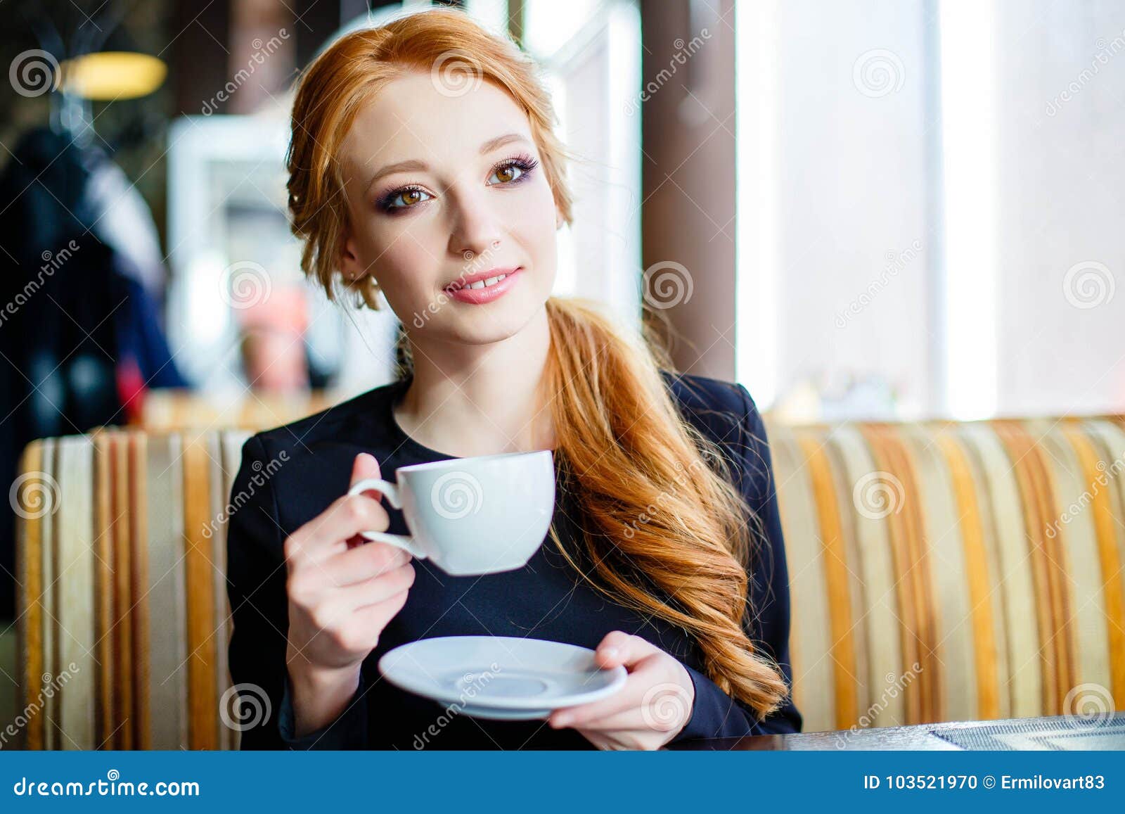 Young Happy Woman Drinking Coffee in Cafe and Smiling. Stock Photo ...