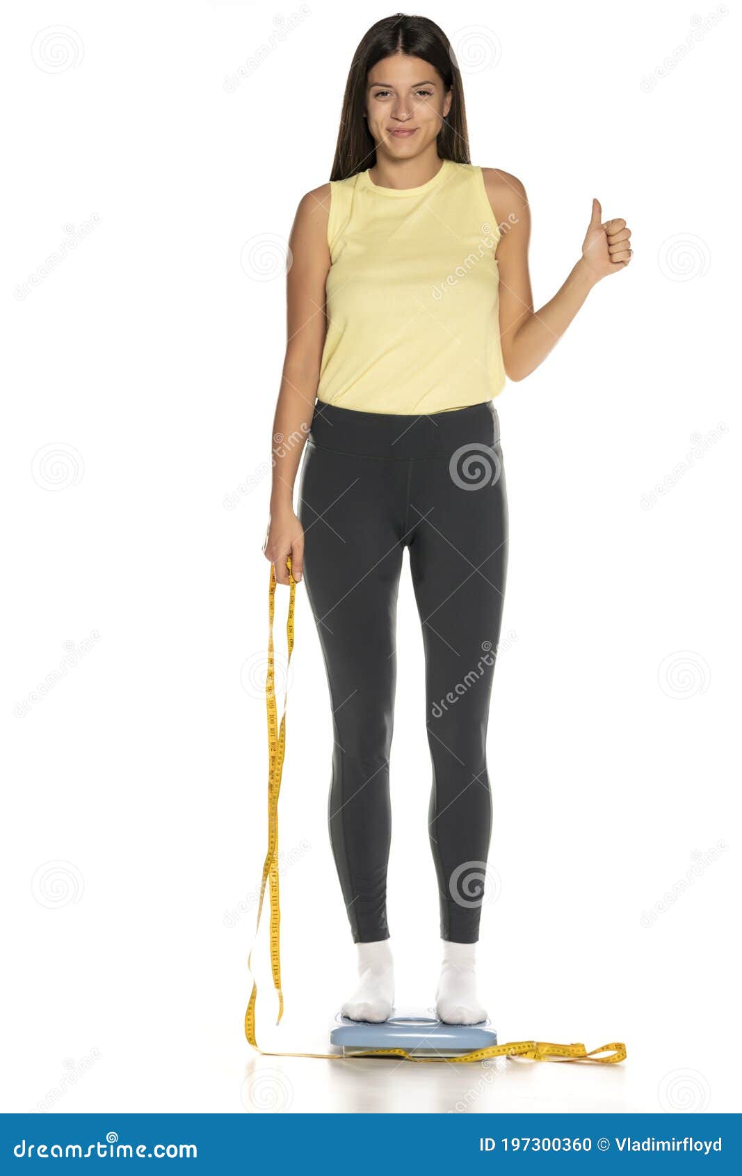 Young Happy Woman Standing on Scale Stock Photo - Image of thumbs ...