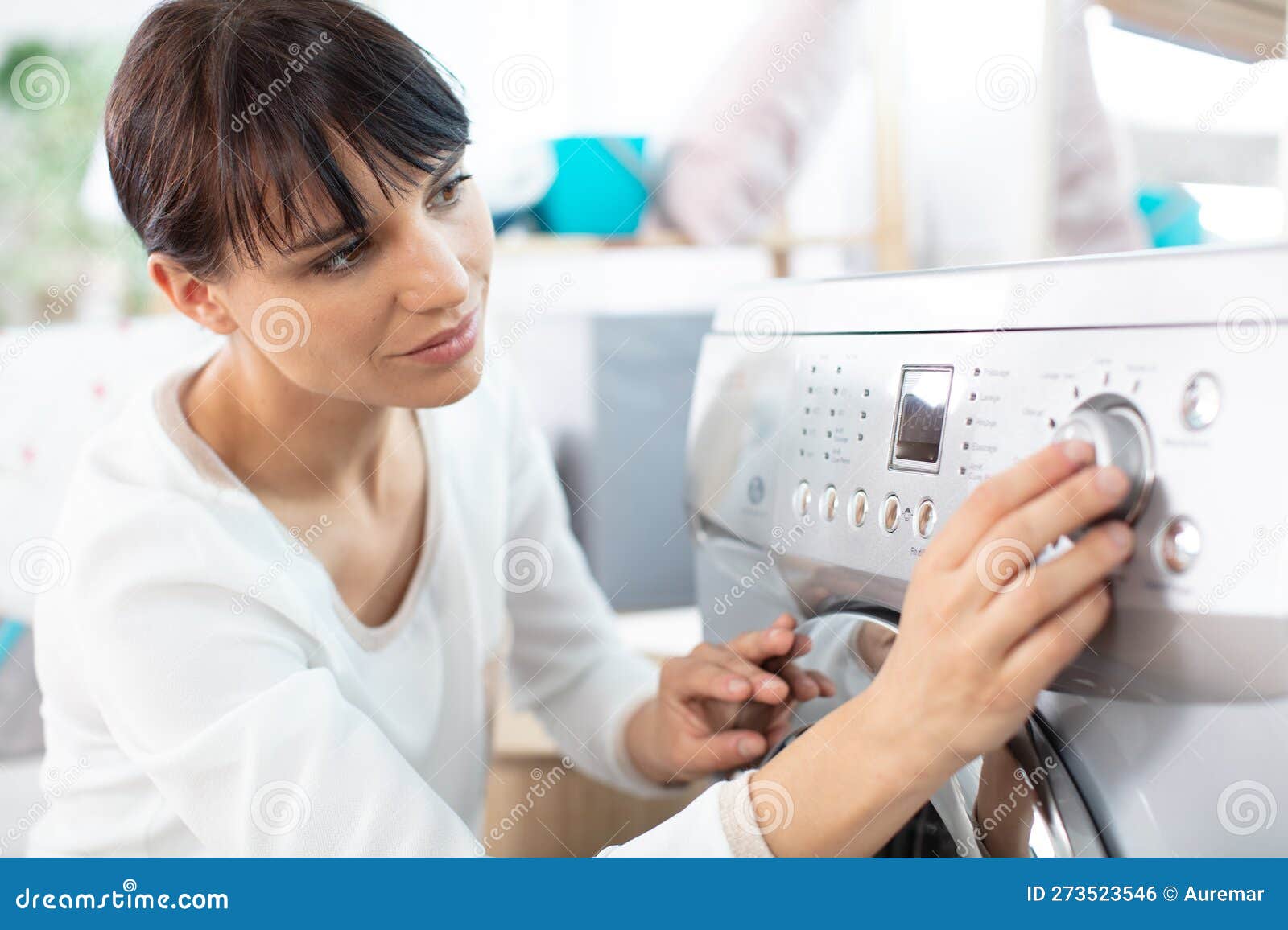 Young Happy Woman Using Washing Machine in Utility Room Stock Photo ...