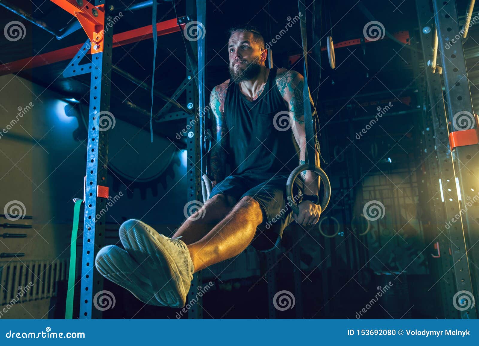 Young Healthy Man Athlete Doing Exercise in the Gym Stock Photo - Image ...