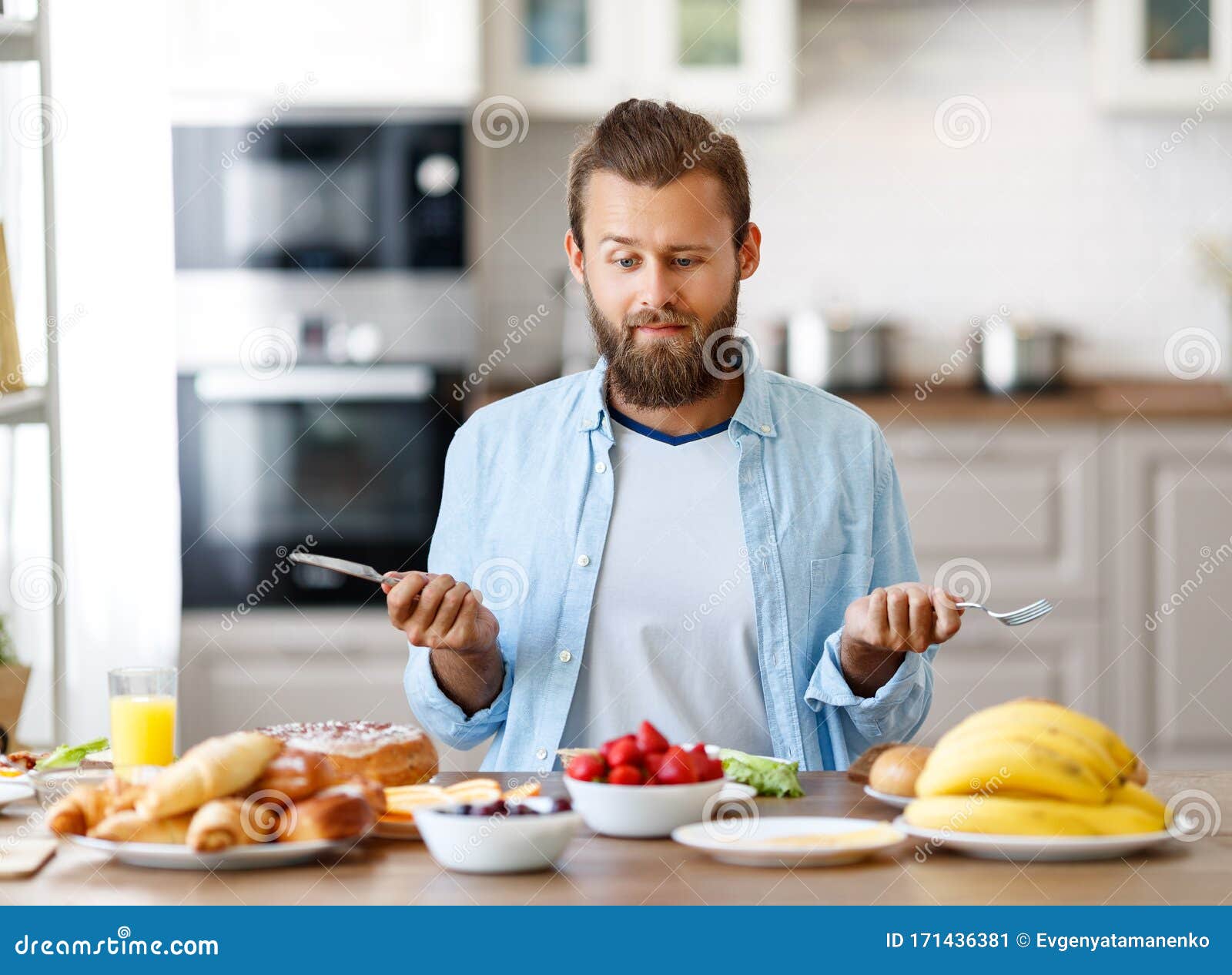 Young Healthy Man Eating Lunch in Kitchen at Home Stock Image - Image ...