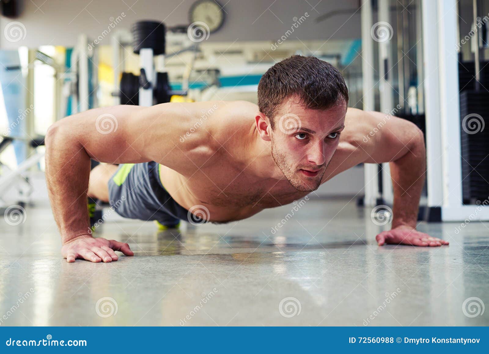 Young Healthy Man Making Push Ups Exercises in Gym Stock Photo - Image ...