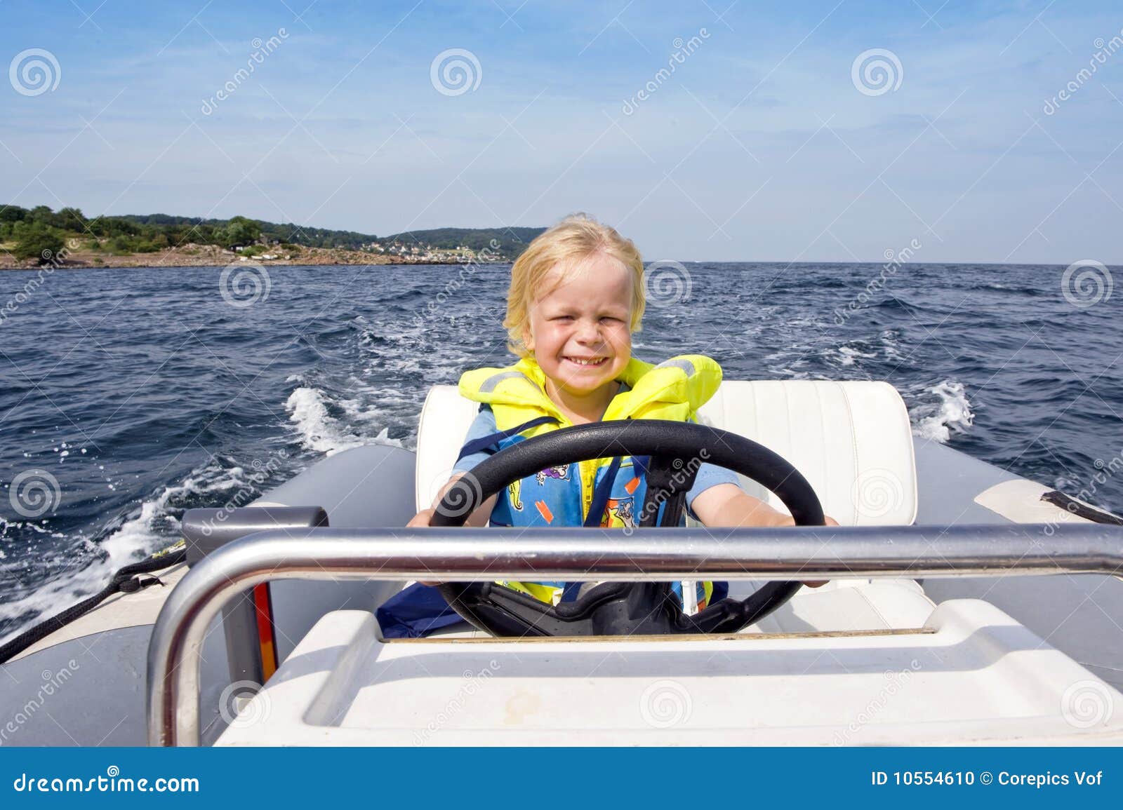 Young helmsman stock photo. Image of dinghy, steer, jacket - 10554610