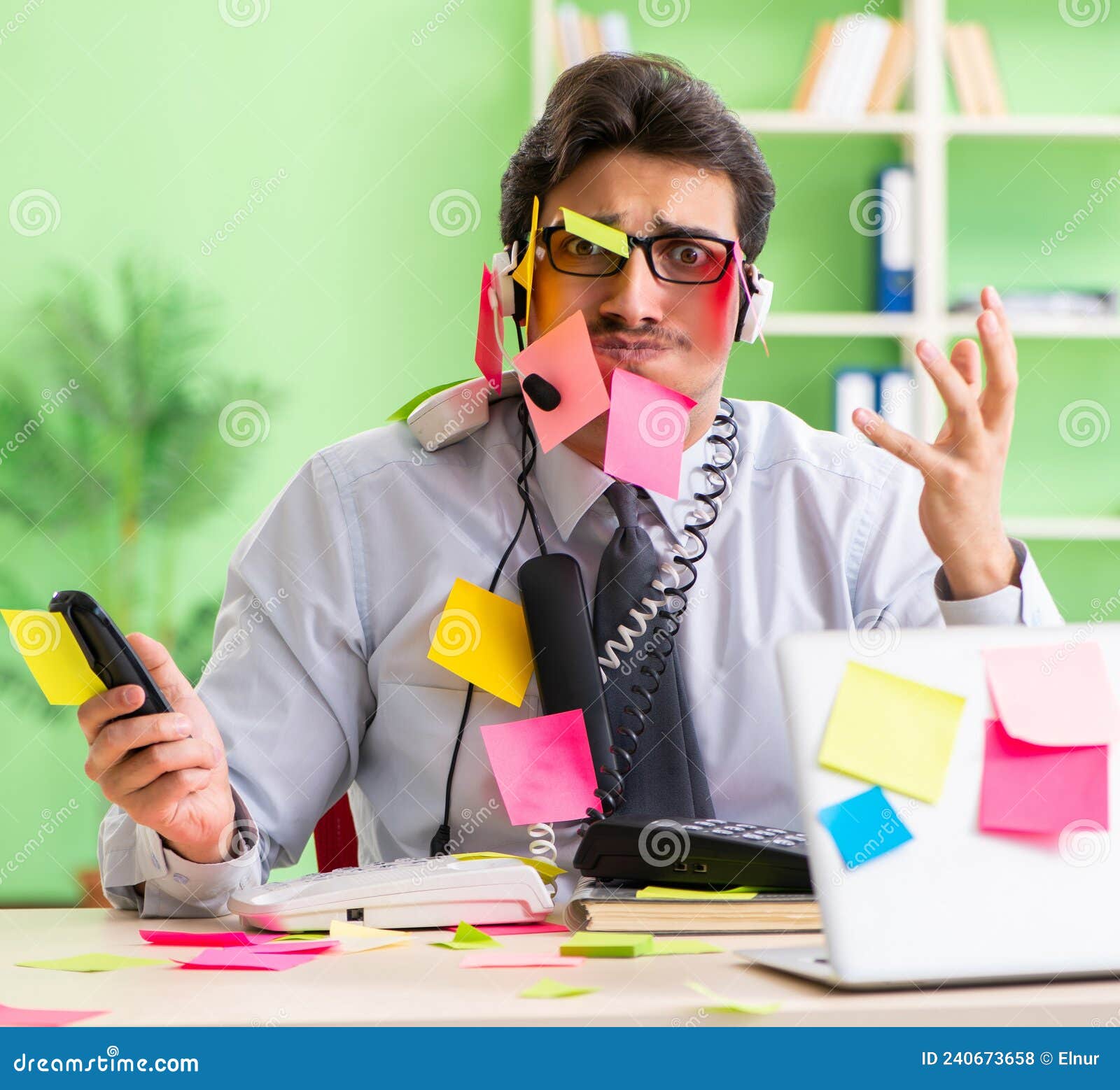 Young Help Desk Operator Working in Office with Many Conflicting Stock ...