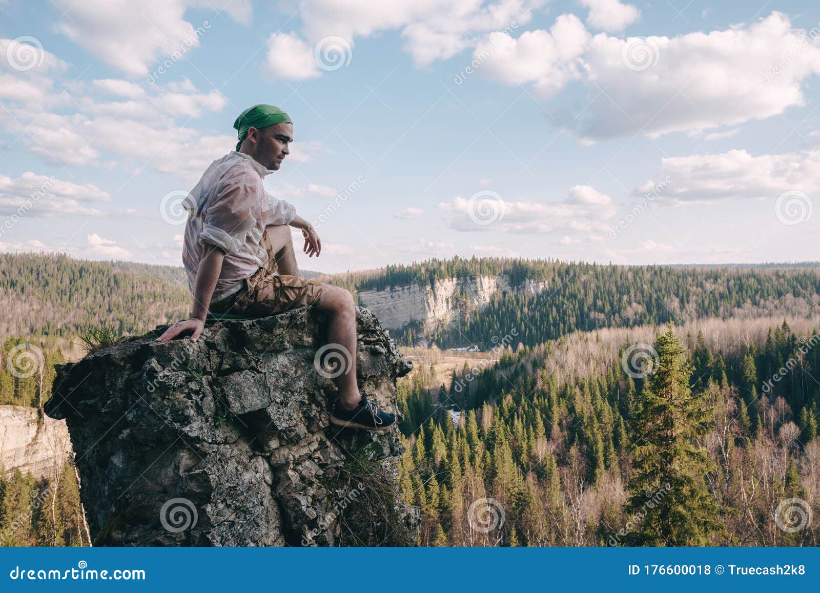 Young Hiker Looking Down from a Top of a Mountain Stock Photo - Image ...